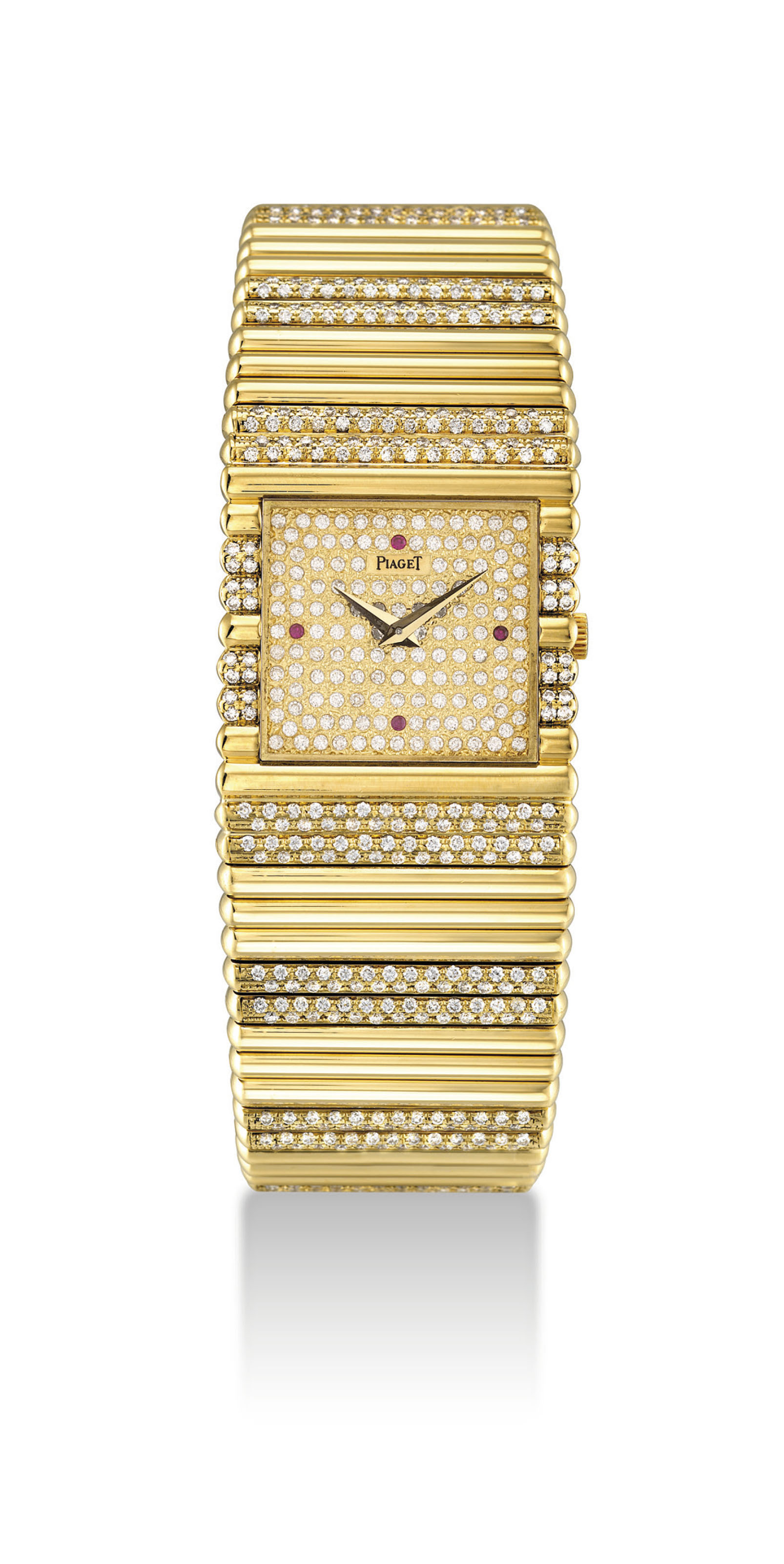 PIAGET. A FINE 18K GOLD, DIAMOND AND RUBY-SET SQUARE BRACELET WATCH
