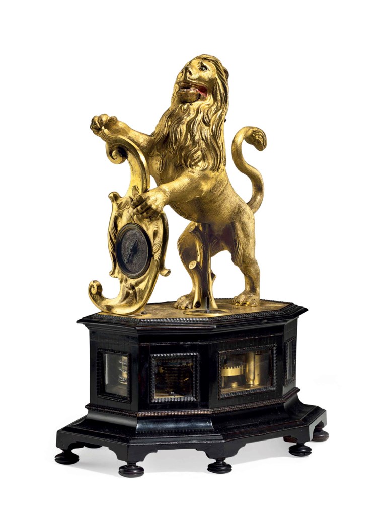 A GERMAN GILT-BRASS AND EBONY STRIKING AND AUTOMATON LION CLOCK