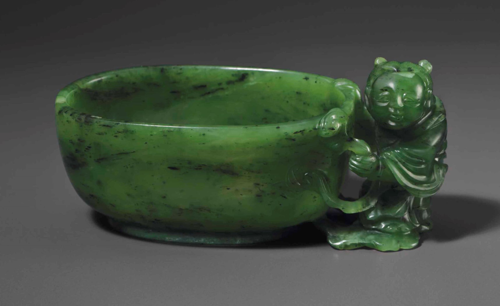 A RARE SMALL GREEN JADE CUP WITH FIGURAL HANDLE, QIANLONG PERIOD (1736 ...
