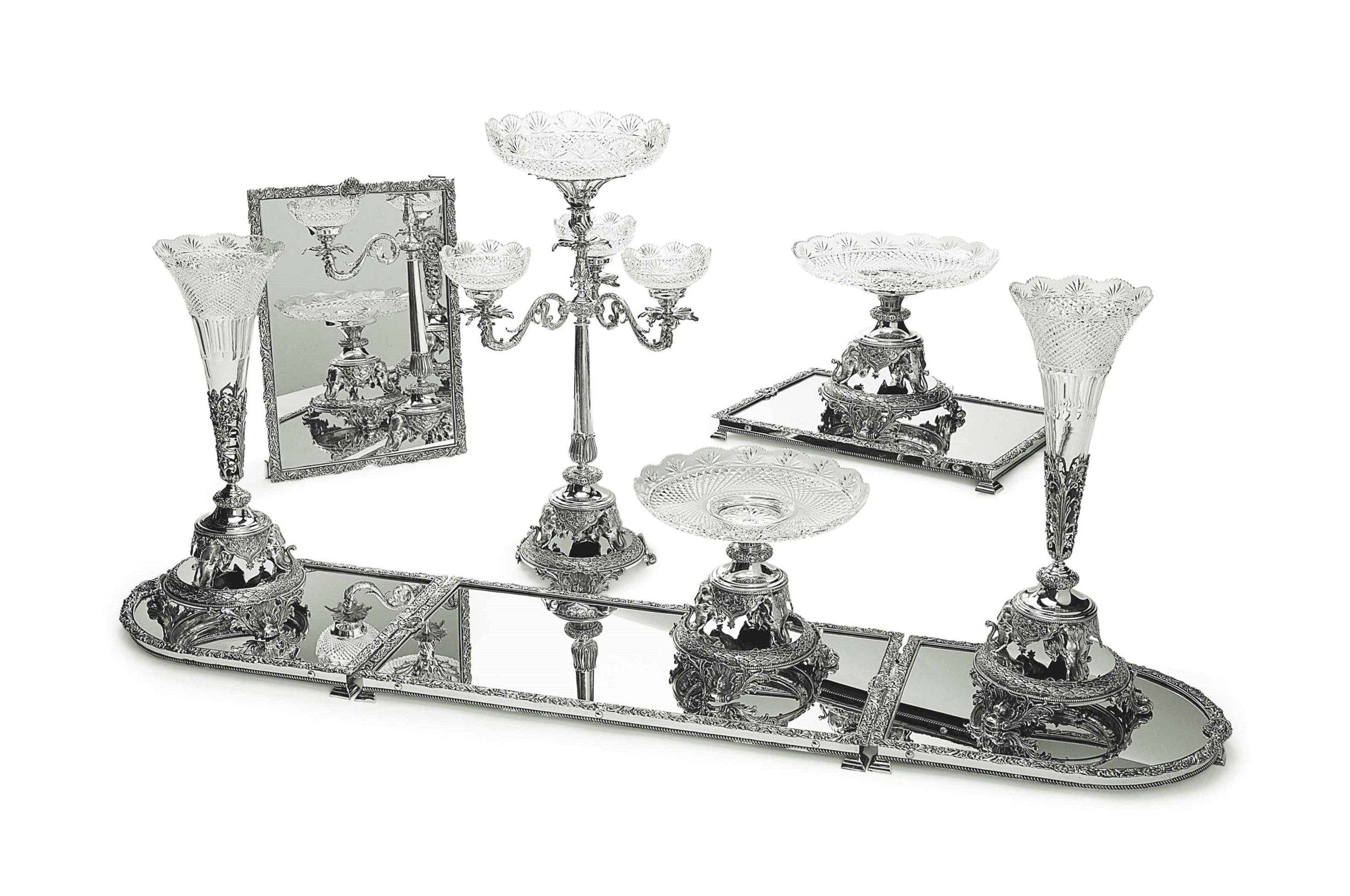 A VICTORIAN SILVER-PLATE AND CUT-GLASS SURTOUT DE TABLE, THE SURTOUT ...