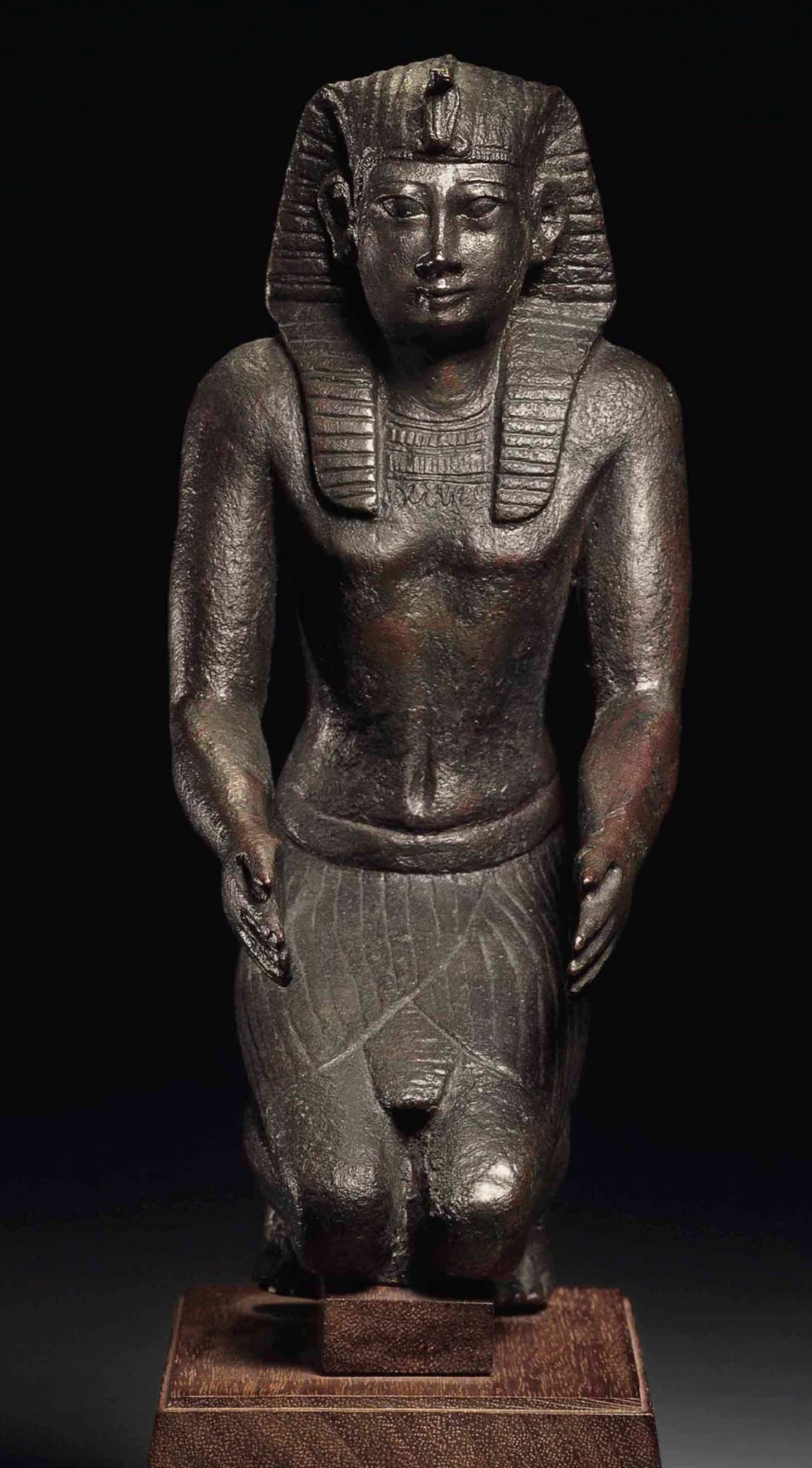 AN EGYPTIAN BRONZE FIGURE OF PHARAOH NECHO II, LATE PERIOD, 26TH ...