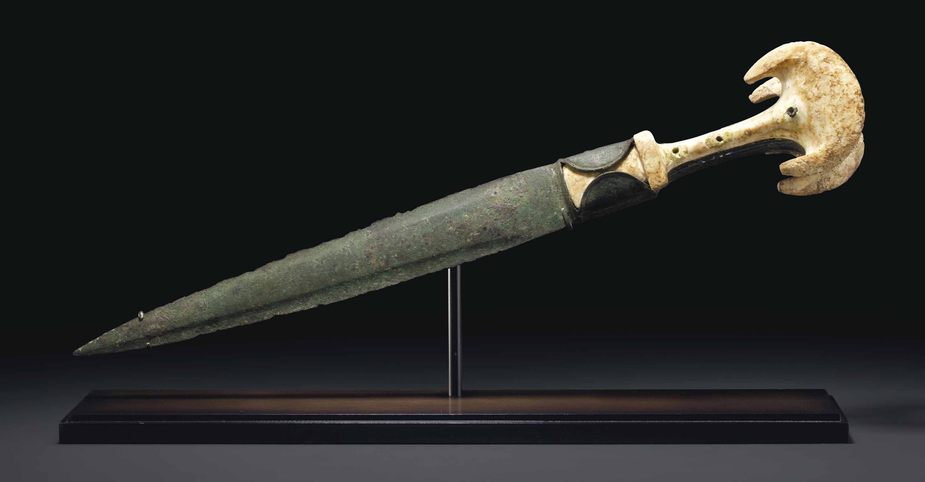 AN IRANIAN BRONZE AND STONE DAGGER , CIRCA EARLY 1ST MILLENNIUM B.C ...