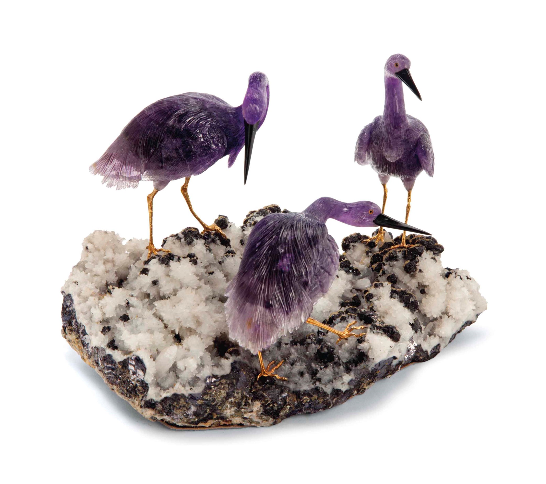 A CARVED AMETHYST GROUP OF THREE CRANES ON A QUARTZ BASE, ERWIN KLEIN ...