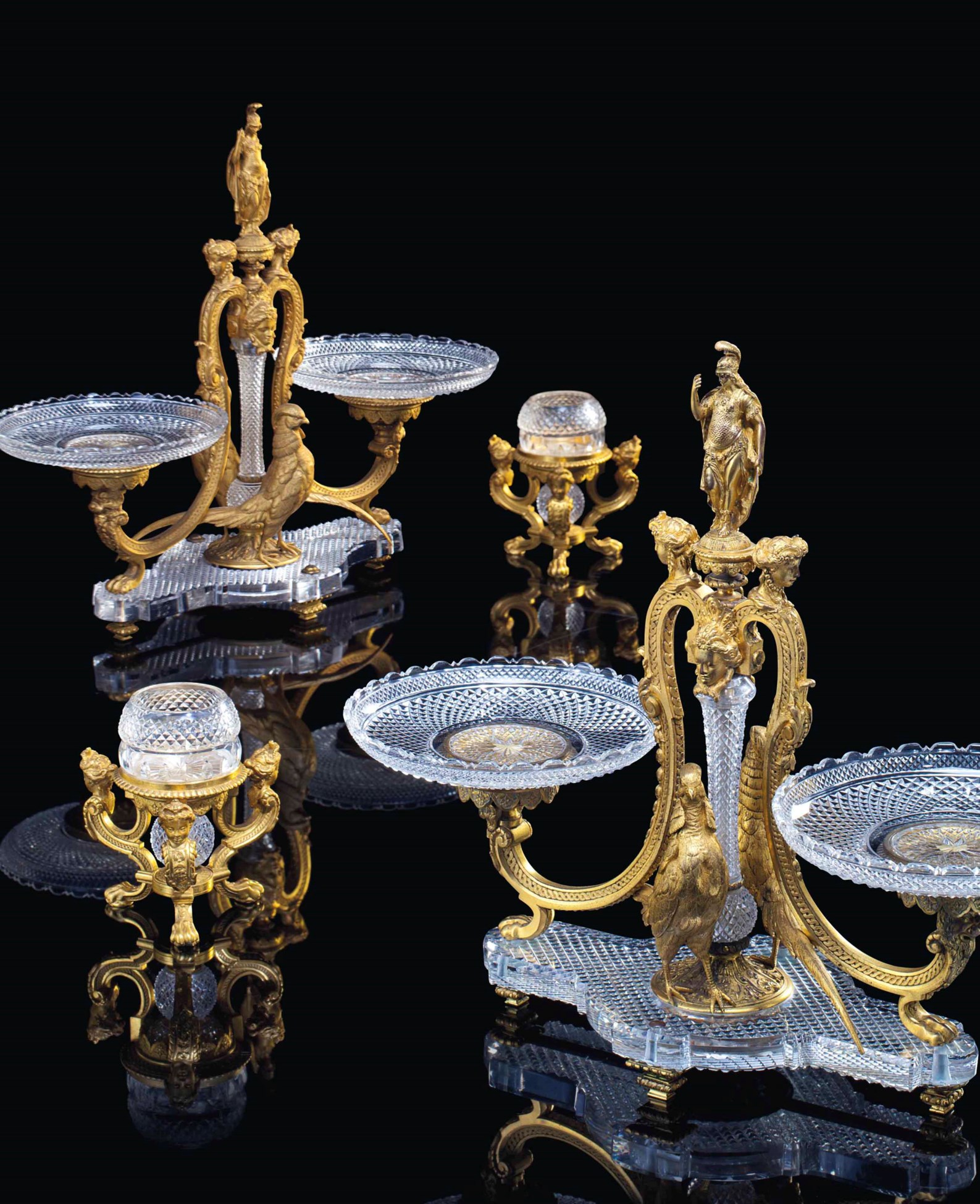 A FRENCH ORMOLU AND CUT-CRYSTAL FOUR-PIECE TABLE GARNITURE