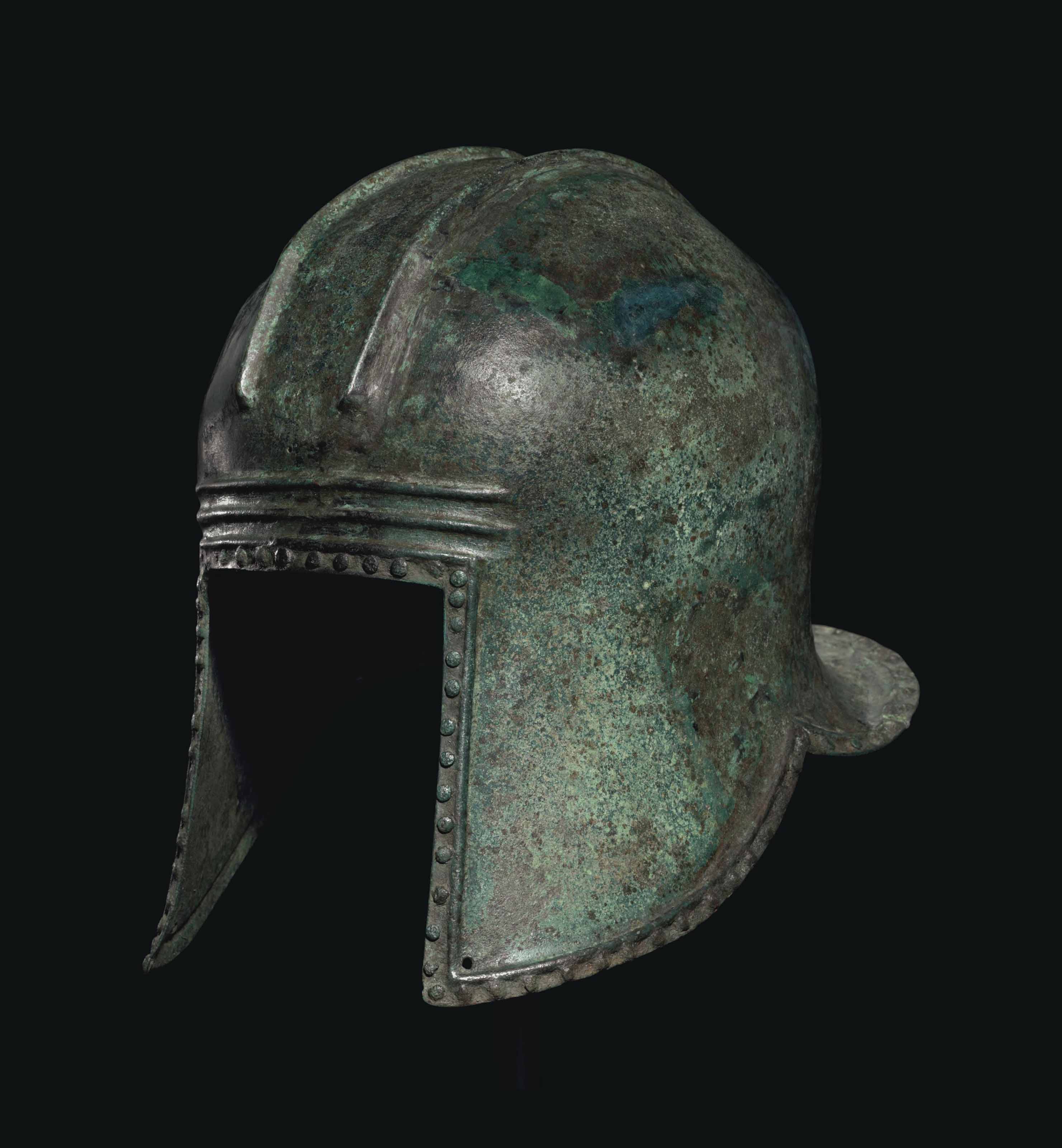 A GREEK BRONZE ILLYRIAN HELMET , ARCHAIC PERIOD, CIRCA 6TH CENTURY B.C. | Christie's