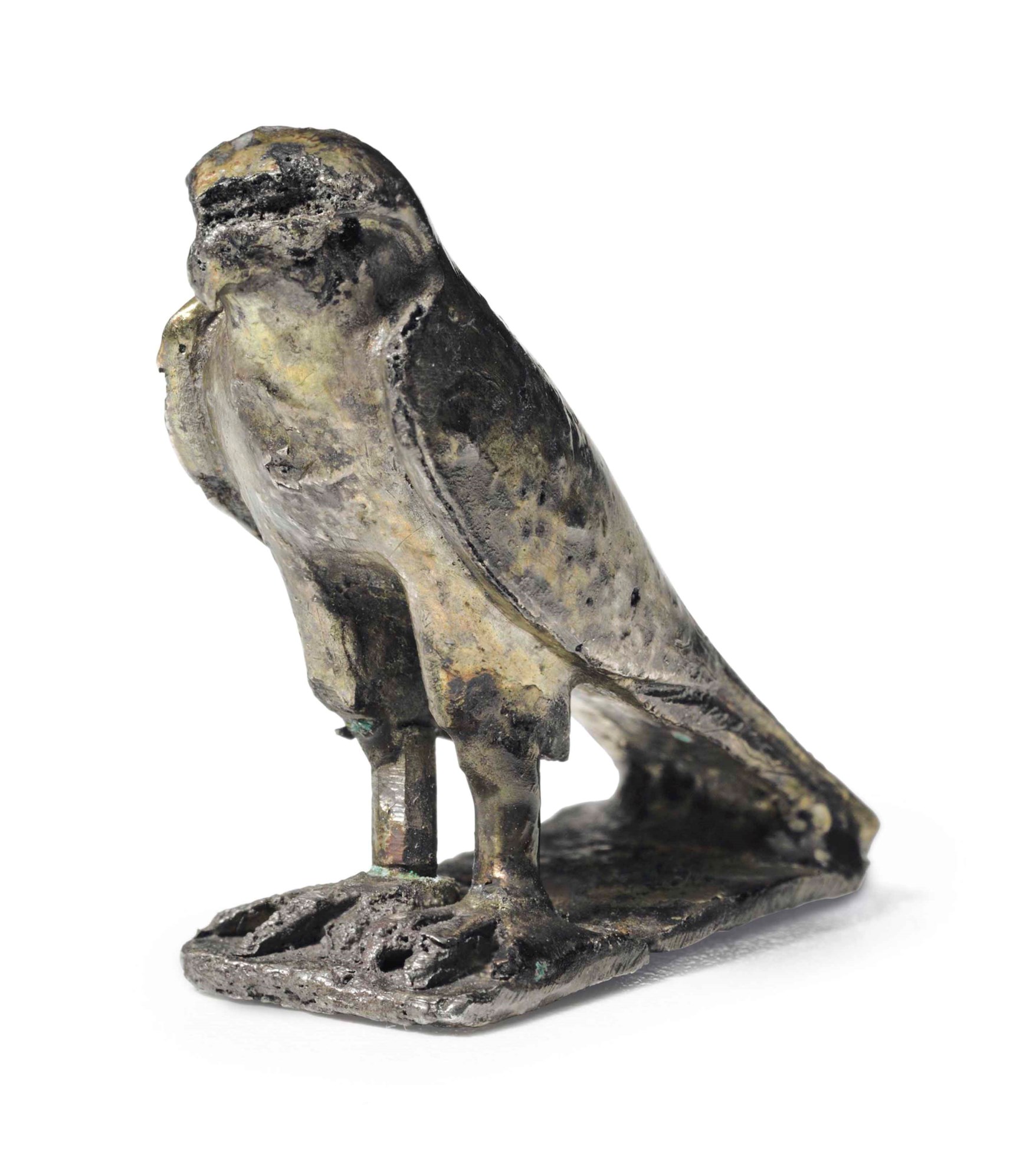 AN EGYPTIAN GILT SILVER FALCON, LATE PERIOD TO PTOLEMAIC PERIOD, 664-30 ...