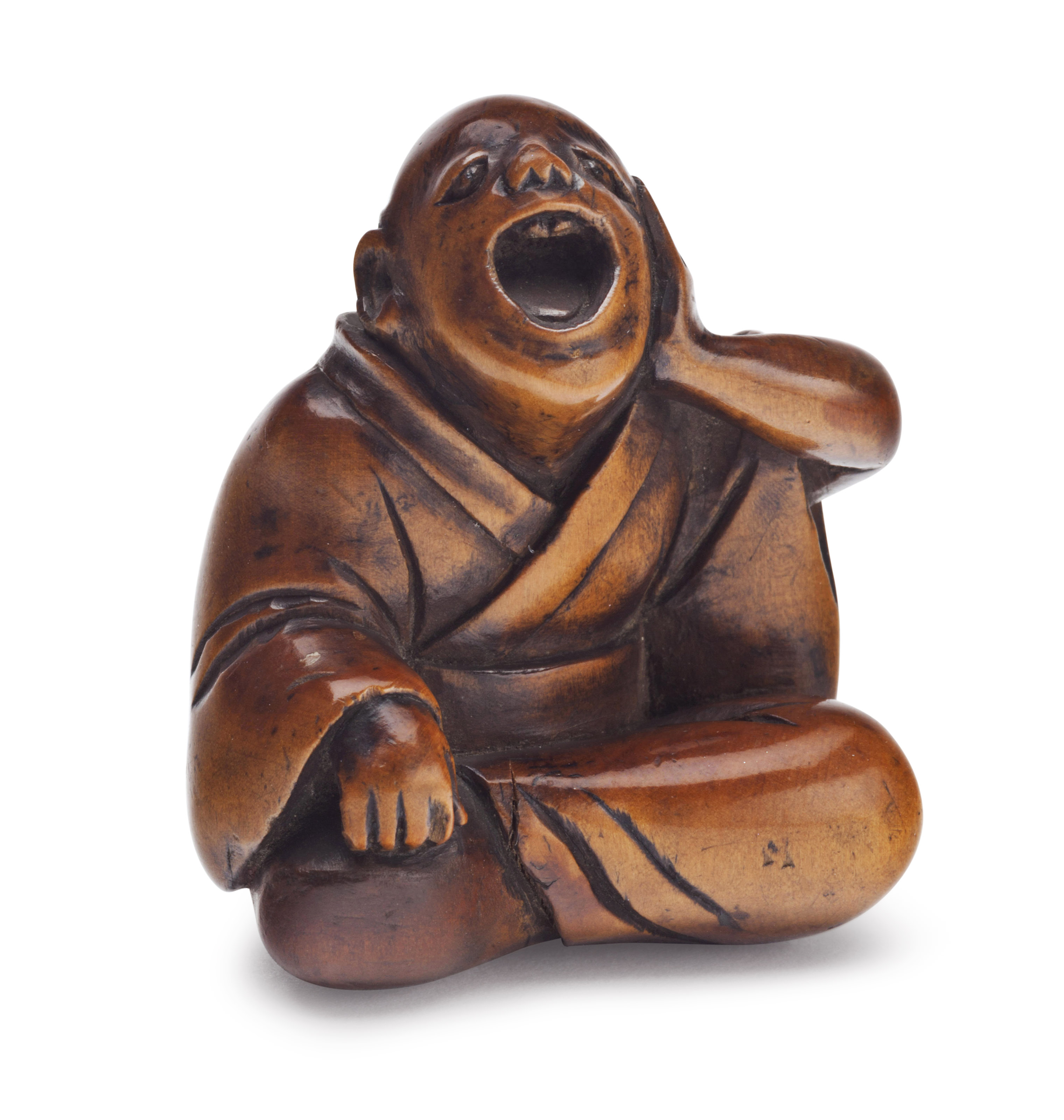 SIGNED JOSUI, EDO PERIOD (19TH CENTURY), A carved wood netsuke of a man ...