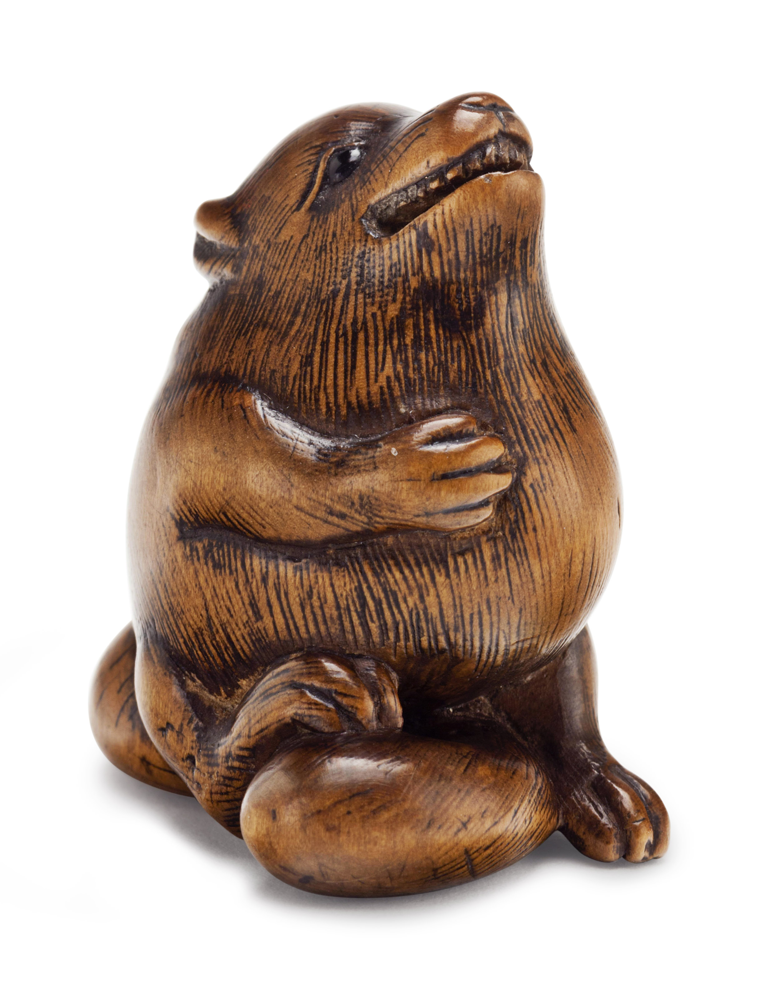 SIGNED RANSEN, EDO PERIOD (19TH CENTURY), A carved wood netsuke of a ...