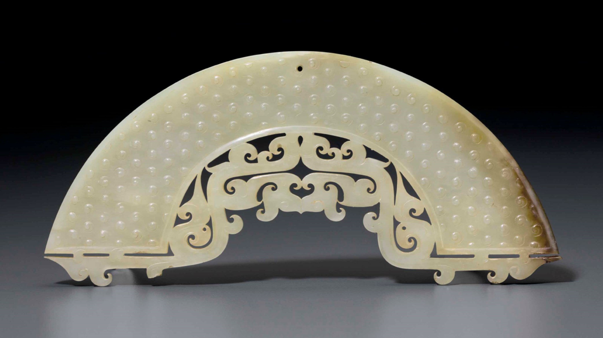 A VERY RARE WHITE JADE ARC-SHAPED PENDANT, HUANG, CHINA, LATE EASTERN ...