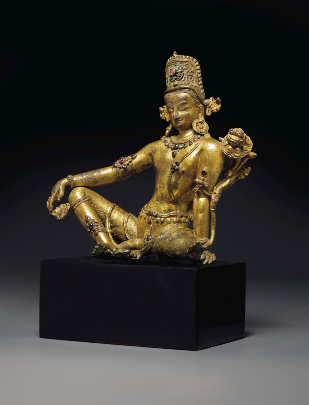 A GILT BRONZE SEATED FIGURE OF INDRA