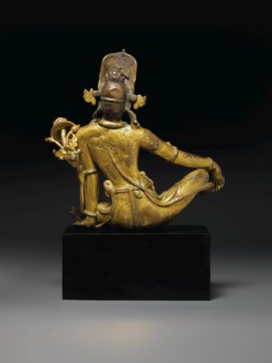 A GILT BRONZE SEATED FIGURE OF INDRA, NEPAL, 14TH/15TH CENTURY | Christie's