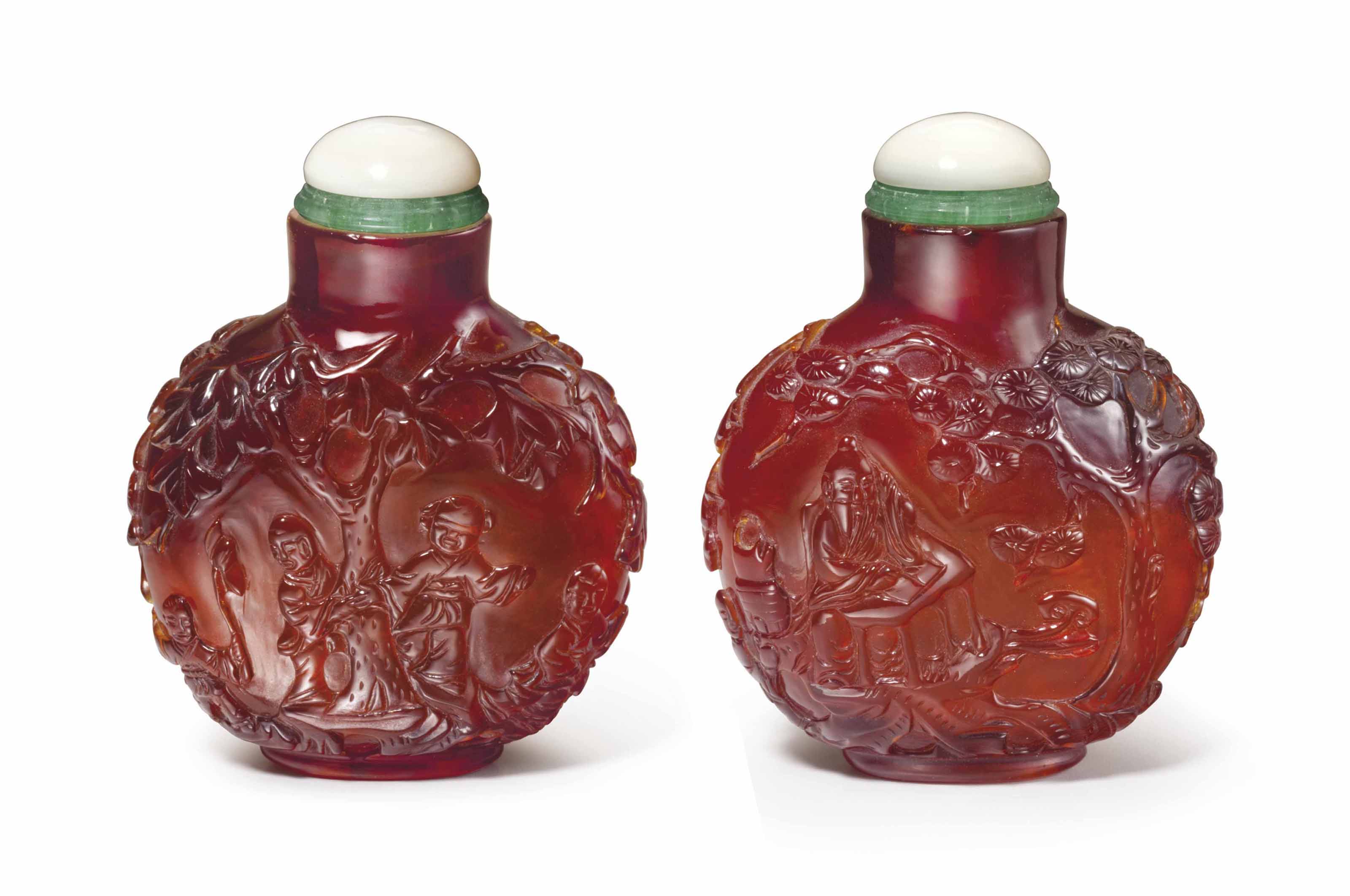 A CARVED AMBER SNUFF BOTTLE