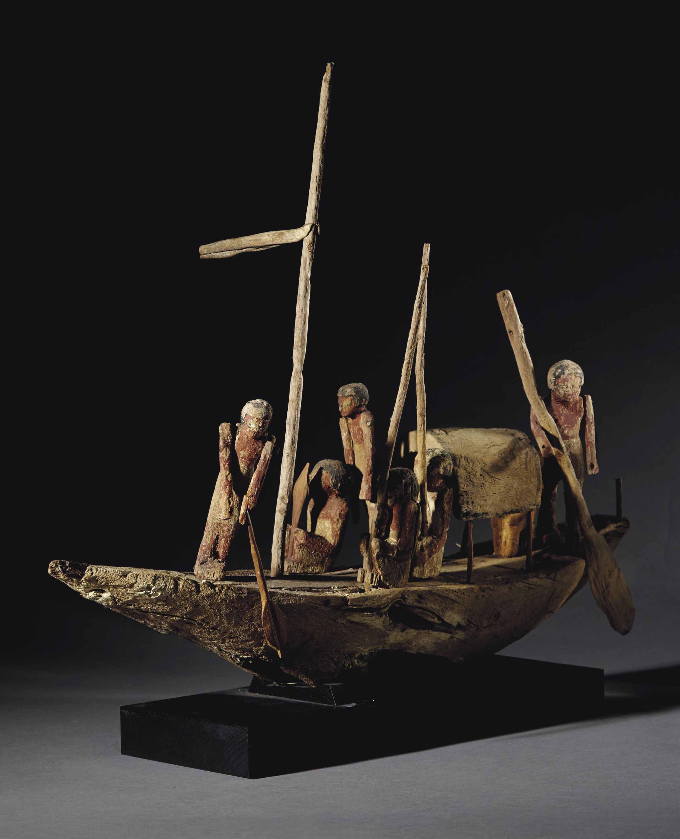 Barque funéraire en bois de palmier - auctions & price archive