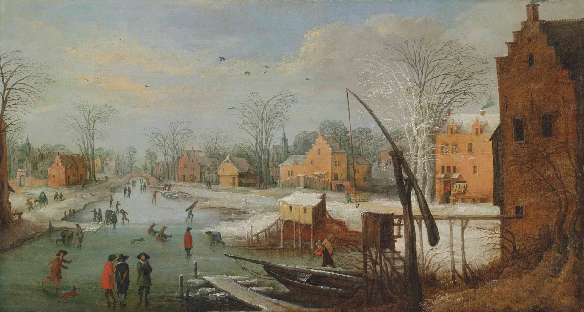 Studio of Joos de Momper II (Antwerp 1564-1635), A winter townscape ...