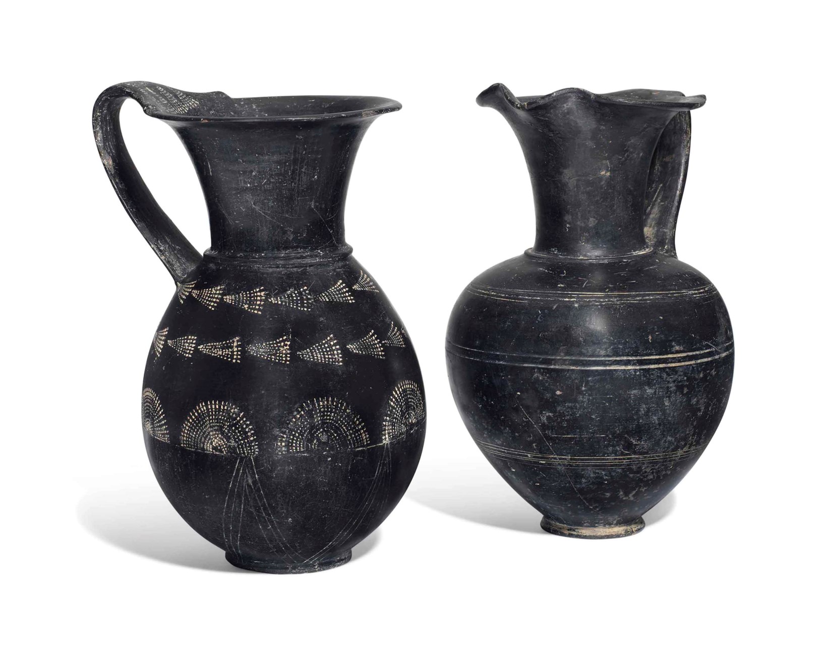 TWO ETRUSCAN BUCCHERO OINOCHOAI, CIRCA 6TH CENTURY B.C. | Christie's