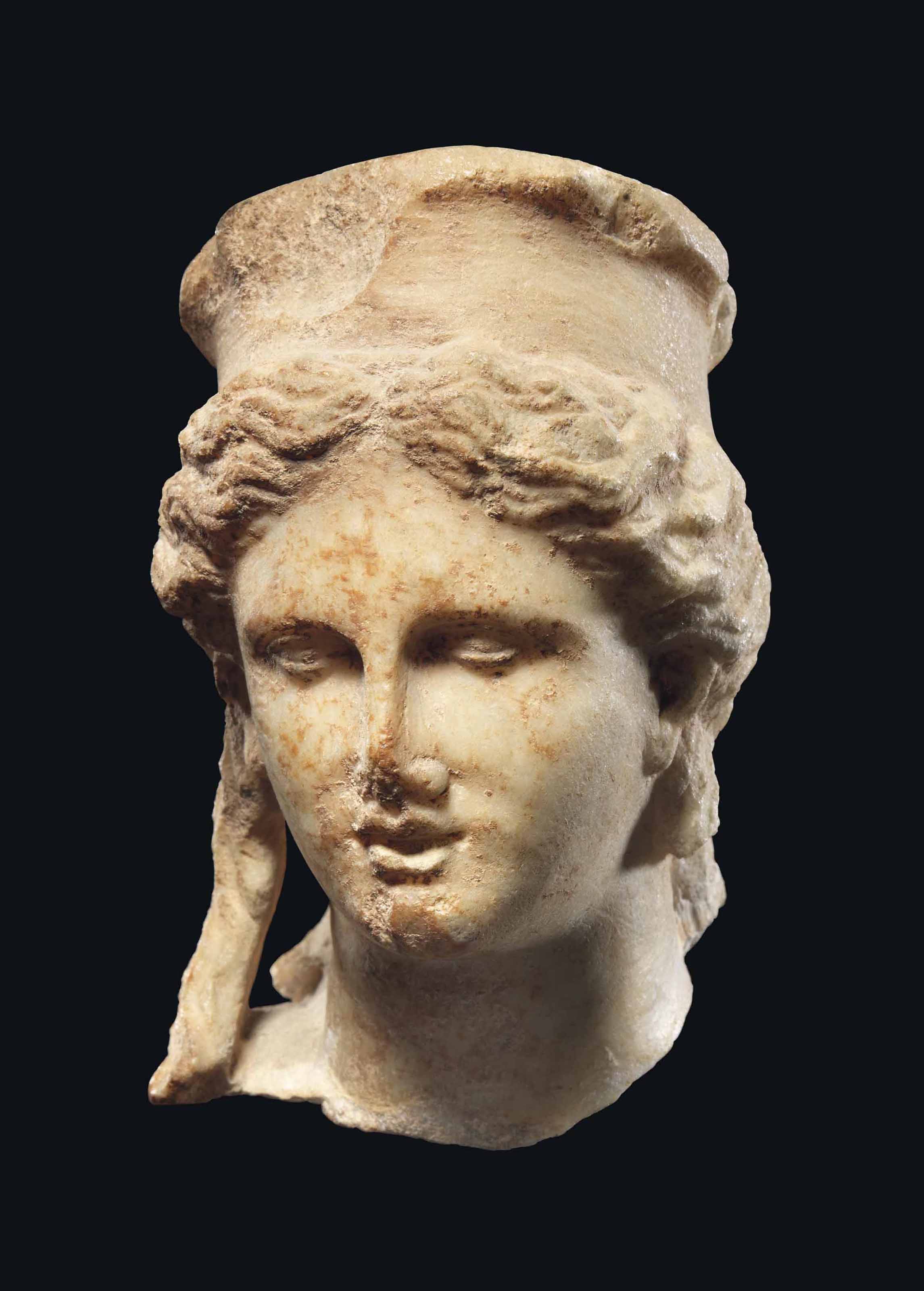 A ROMAN MARBLE HEAD OF CYBELE
