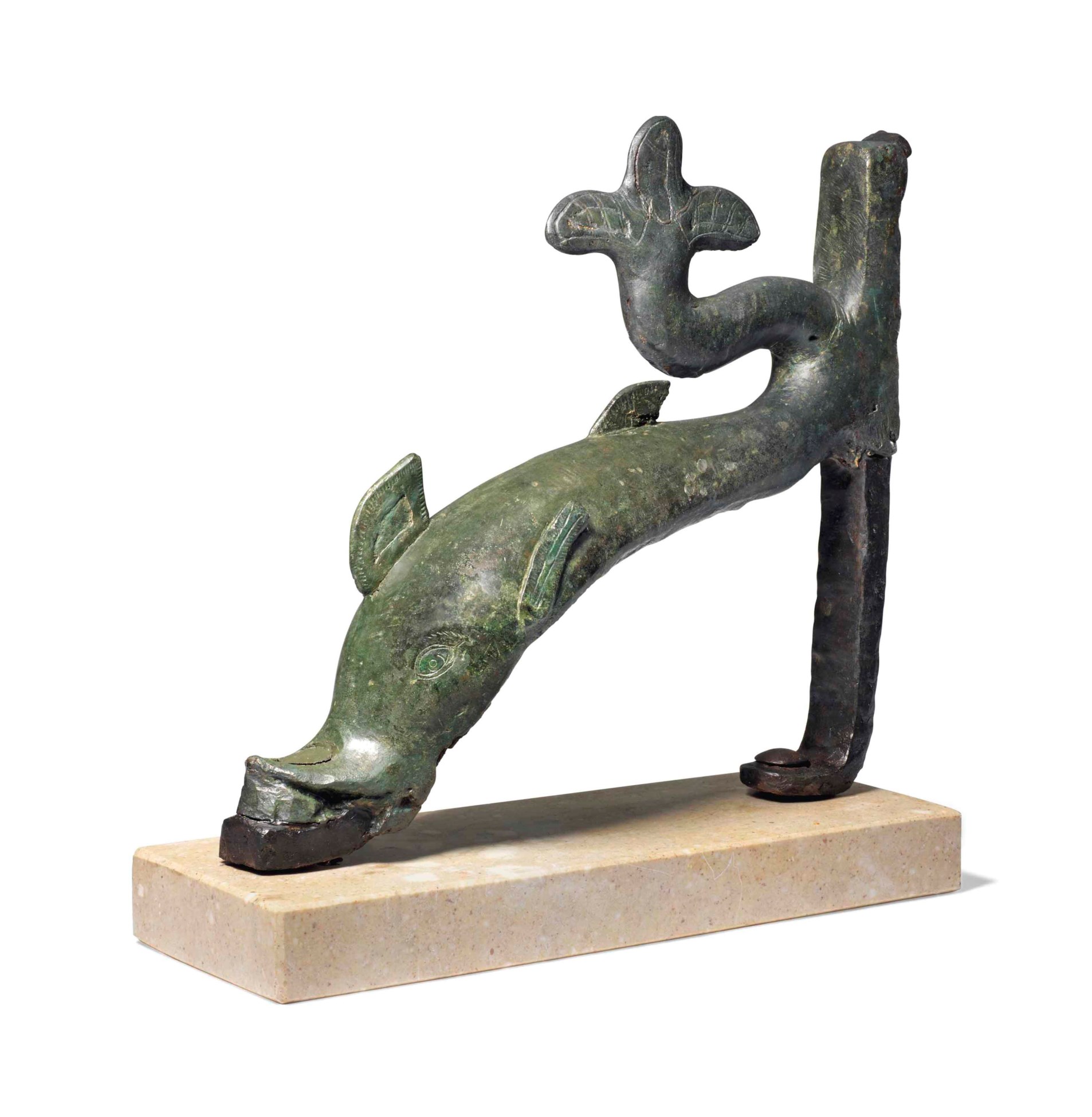 A ROMAN BRONZE SUPPORT IN THE FORM OF A DOLPHIN, CIRCA 3RD CENTURY A.D ...