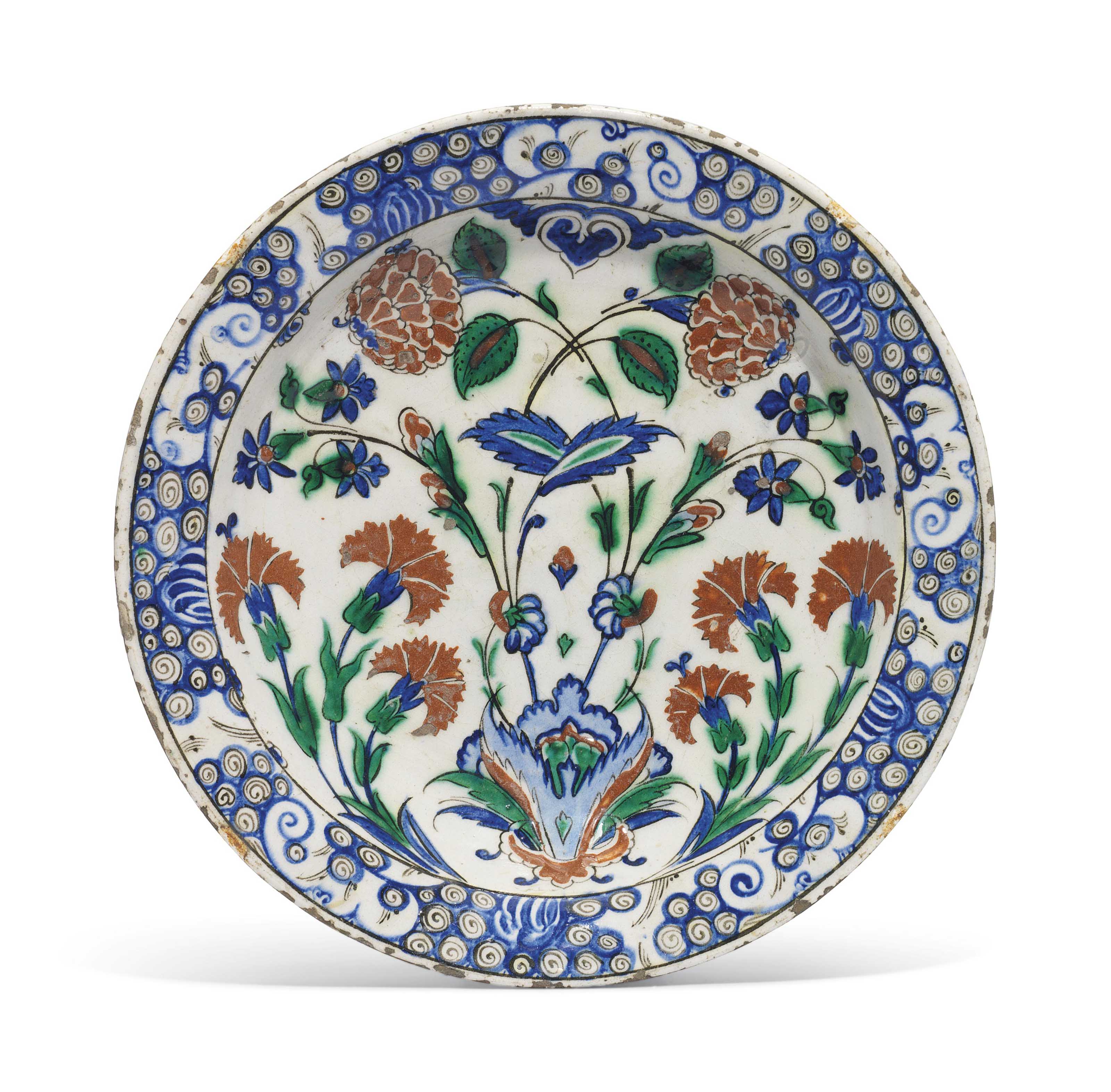 A LARGE IZNIK POTTERY DISH , OTTOMAN TURKEY, CIRCA 1590-1600 | Christie's