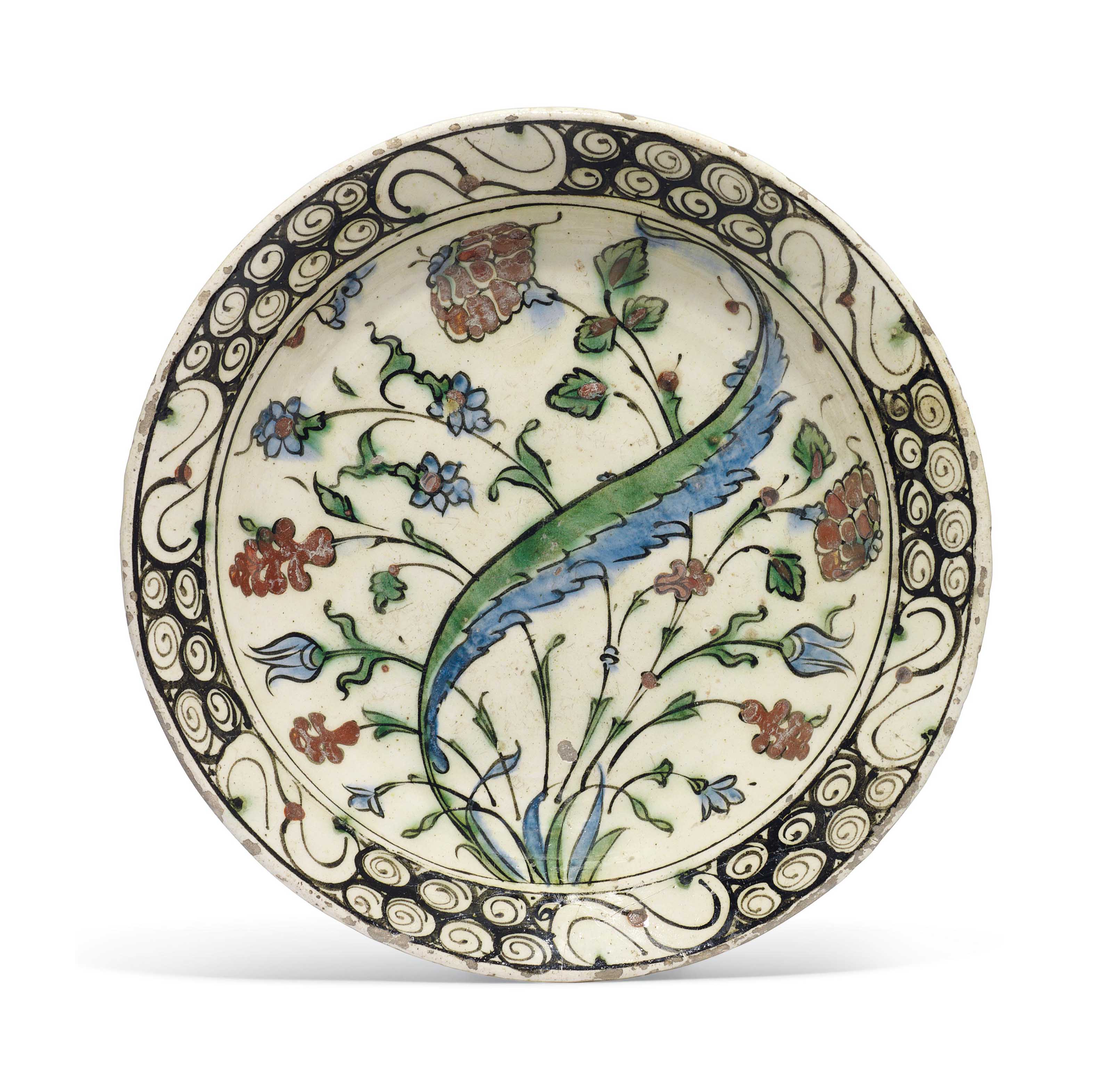 AN IZNIK POTTERY DISH, OTTOMAN TURKEY, CIRCA 1565 | Christie's