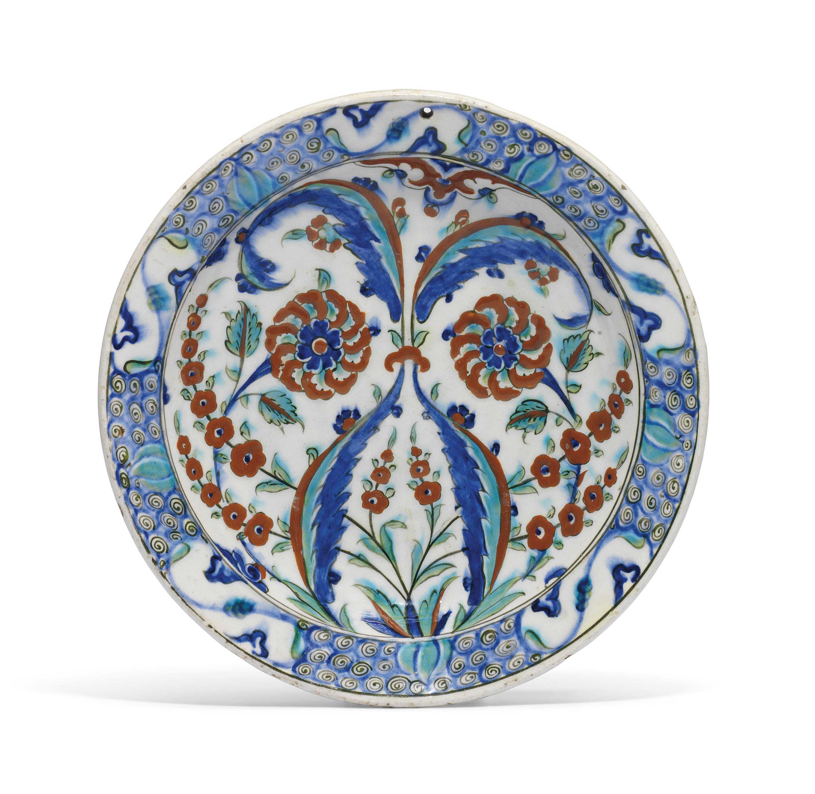 AN IZNIK POTTERY DISH, OTTOMAN TURKEY, CIRCA 1565 | Christie's