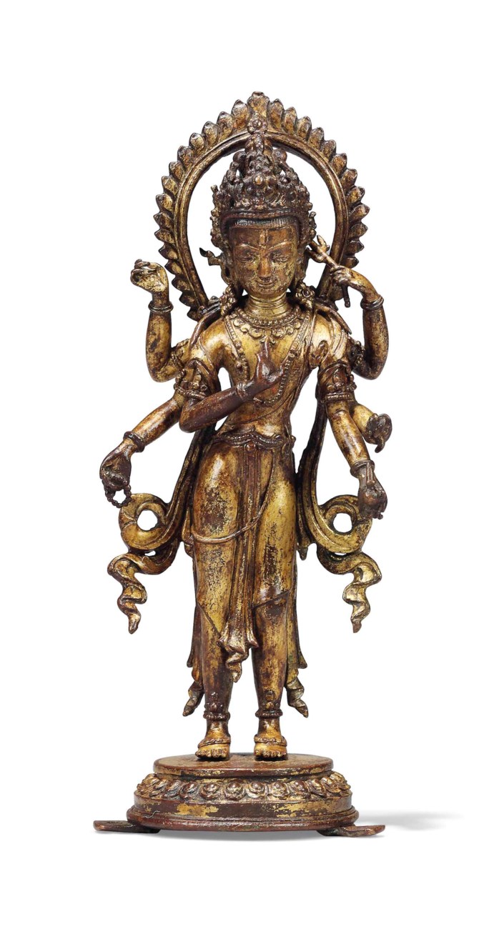 A GILT-BRONZE FIGURE OF AMOGHAPASHA, NEPAL, 17TH CENTURY | Christie's