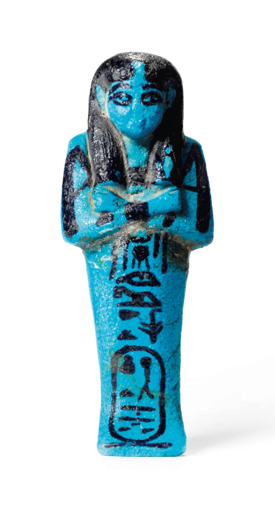 AN EGYPTIAN BLUE FAIENCE SHABTI FOR QUEEN HENUTTAWY, THIRD INTERMEDIATE ...