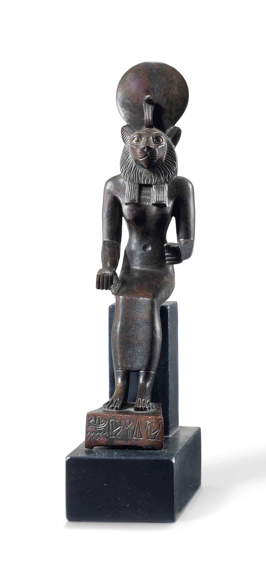 AN EGYPTIAN BRONZE WADJET-BAST, LATE PERIOD, 26TH DYNASTY, CIRCA 664 ...