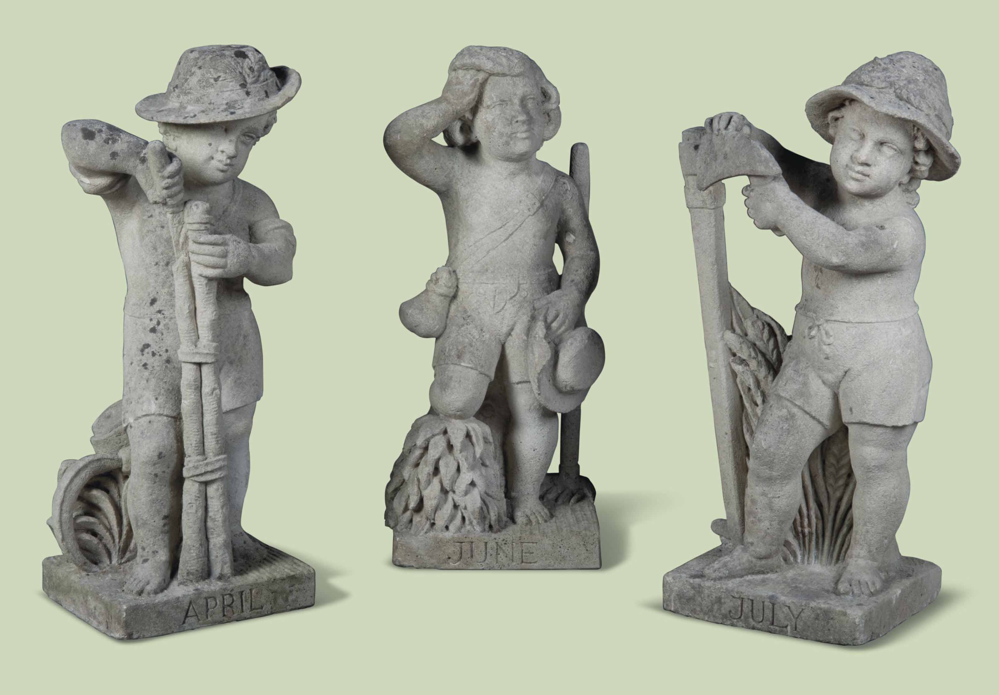 A SET OF THREE PORTLAND STONE GARDEN FIGURES