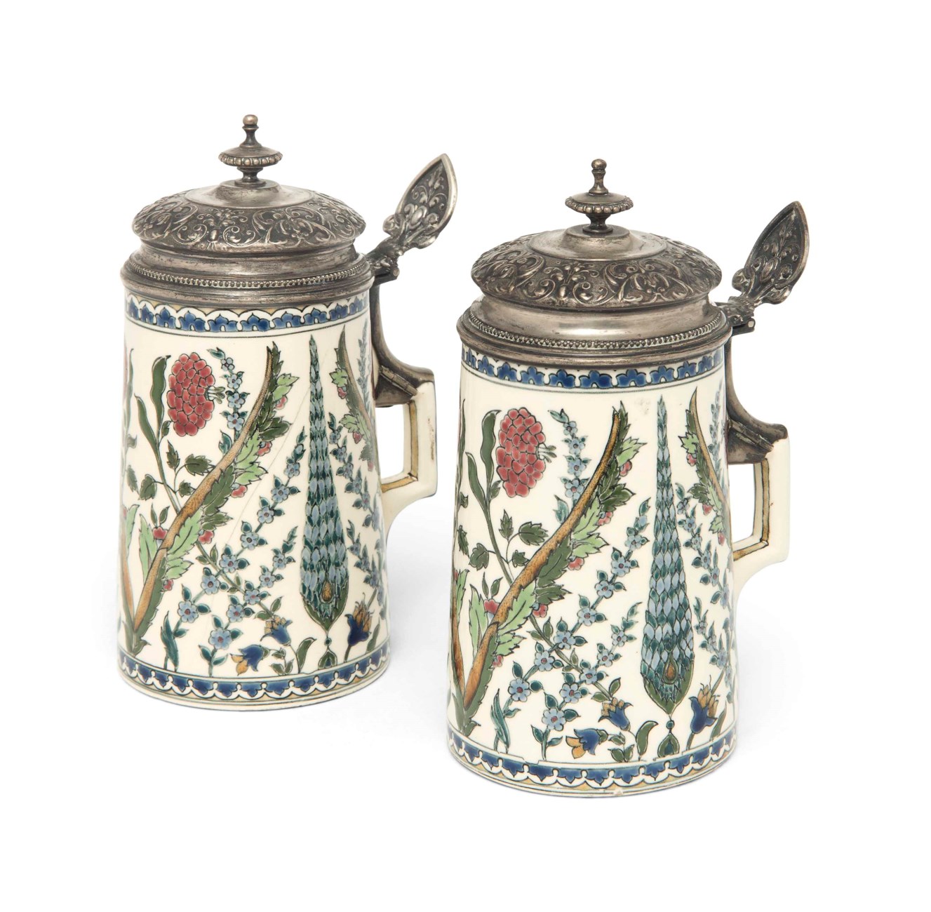 TWO FINE IZNIK-STYLE POTTERY TANKARDS WITH PARCEL-GILT SILVER MOUNTS, W ...