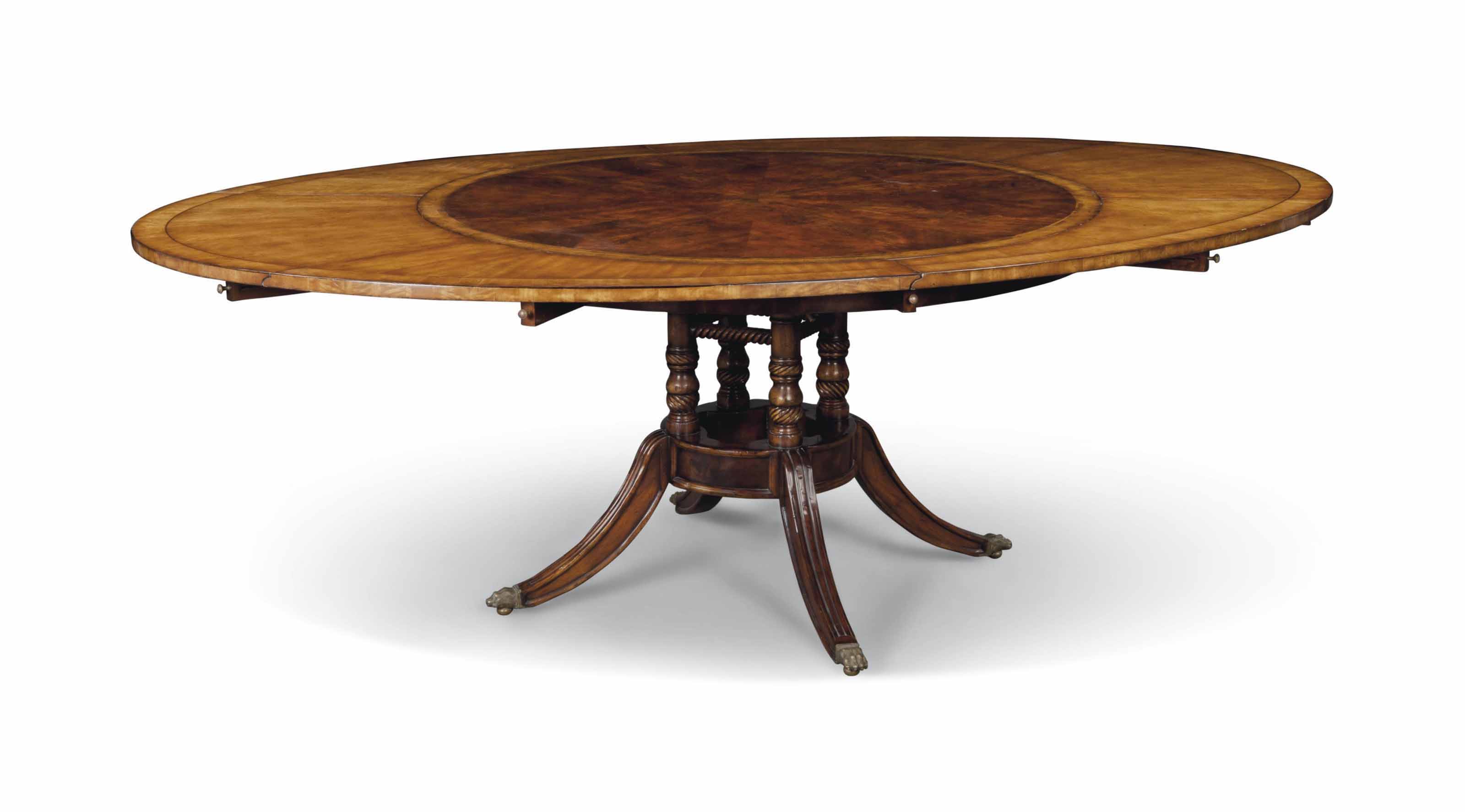 A MAHOGANY EXTENDING PEDESTAL DINING TABLE