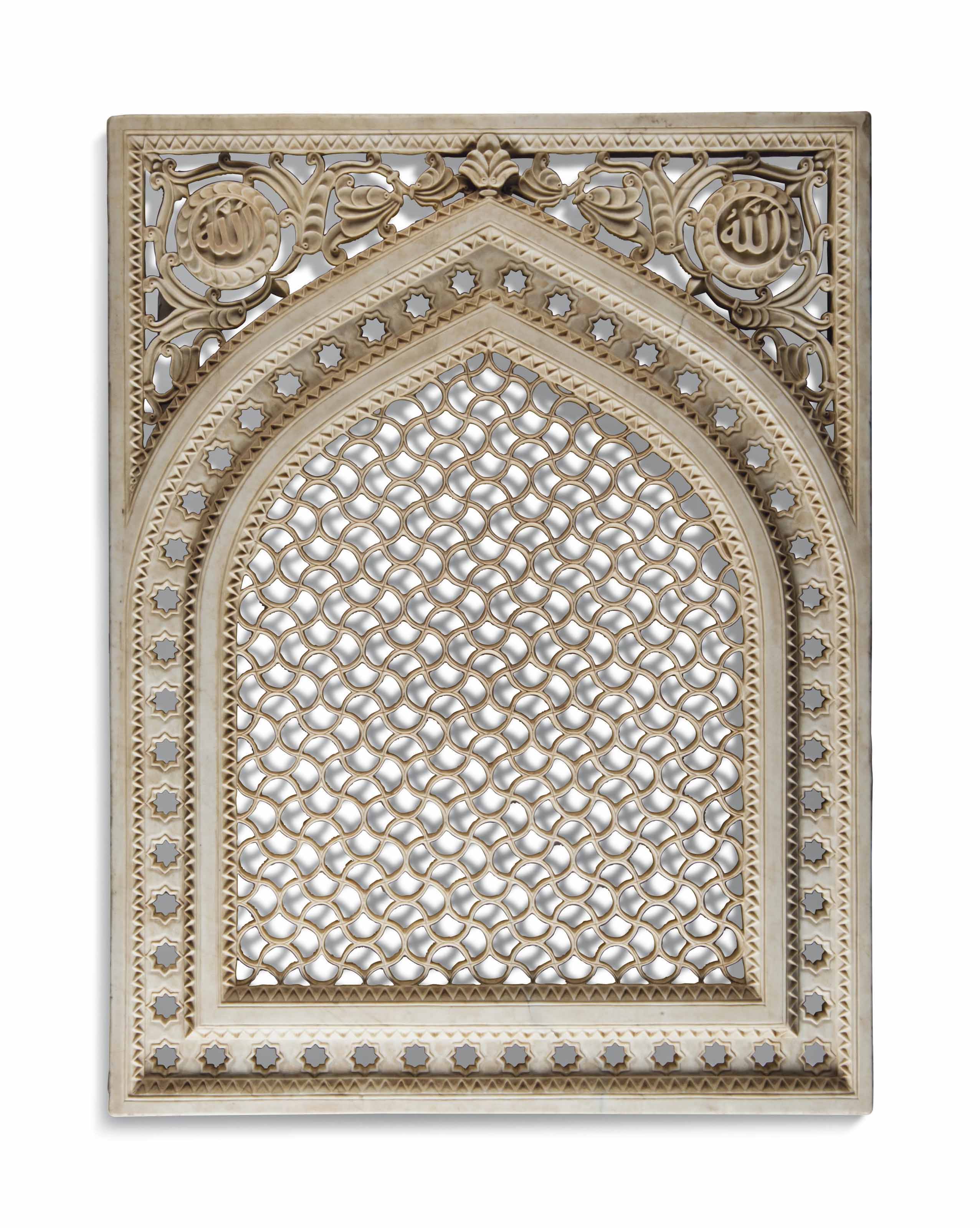 AN INDIAN CARVED AND PIERCED MARBLE 'JALI' SCREEN