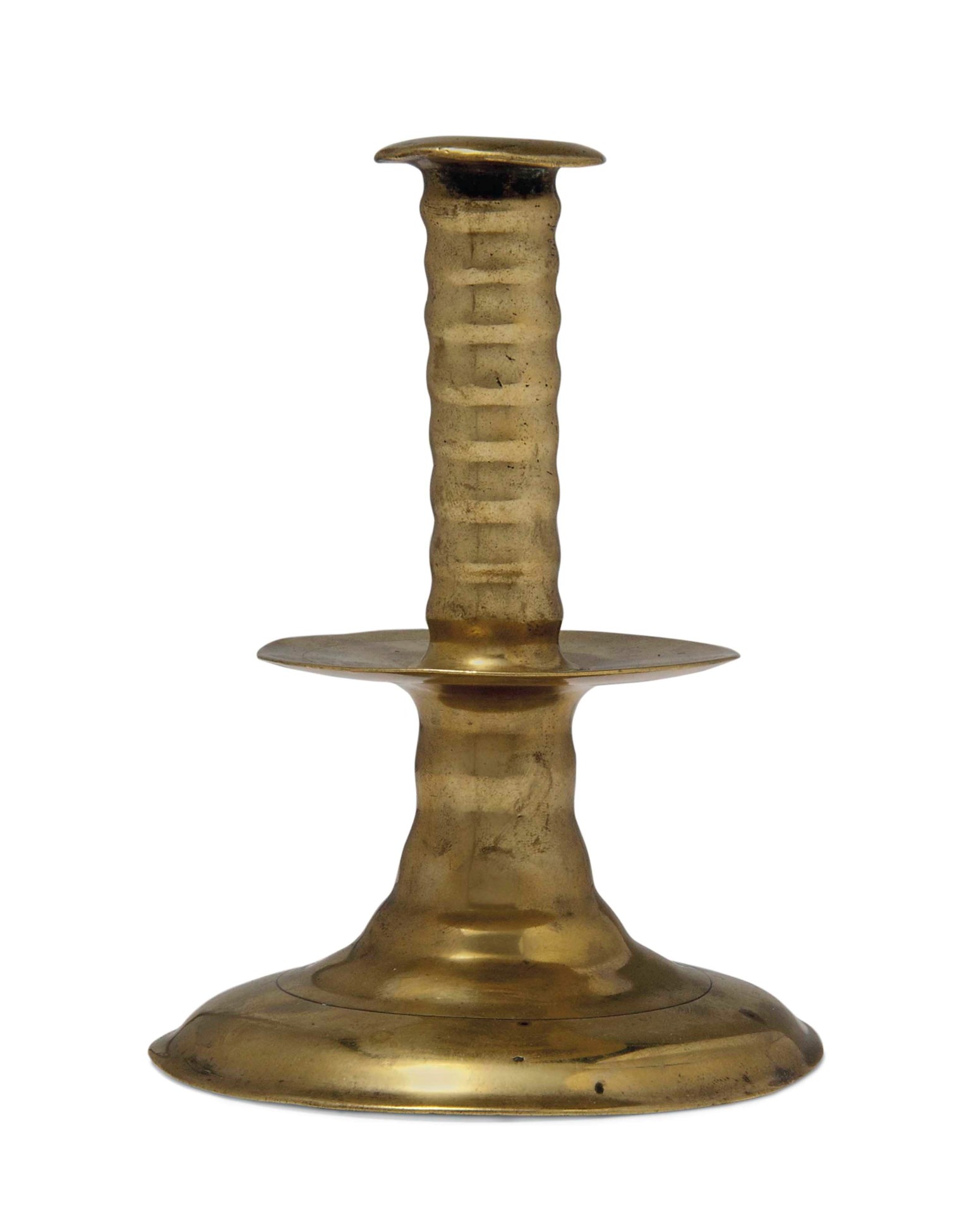 A BRASS 'TRUMPET-BASE' CANDLESTICK, ENGLAND, CIRCA 1680 | Christie's