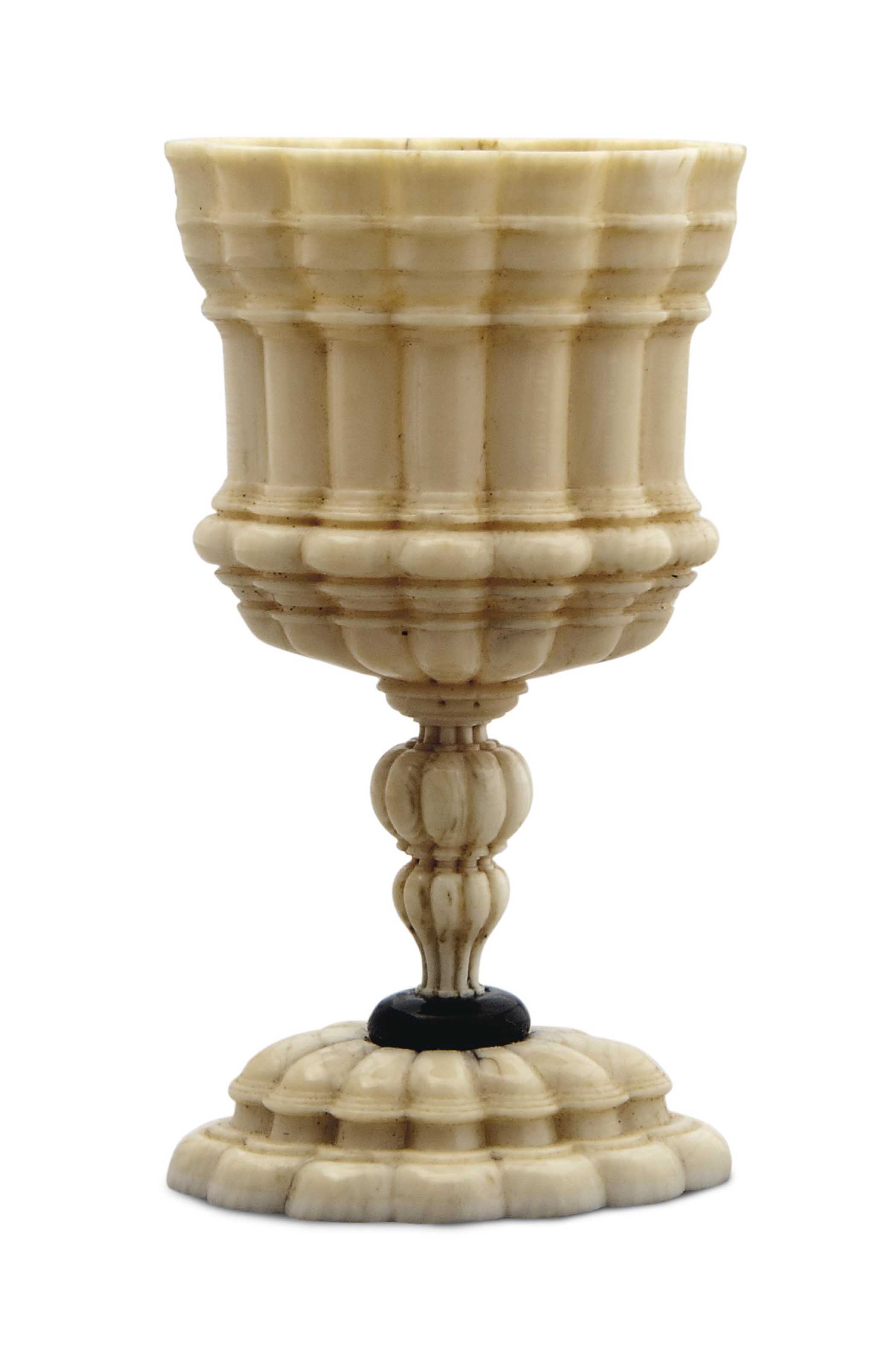 AN IVORY ENGINE-TURNED SMALL STANDING CUP