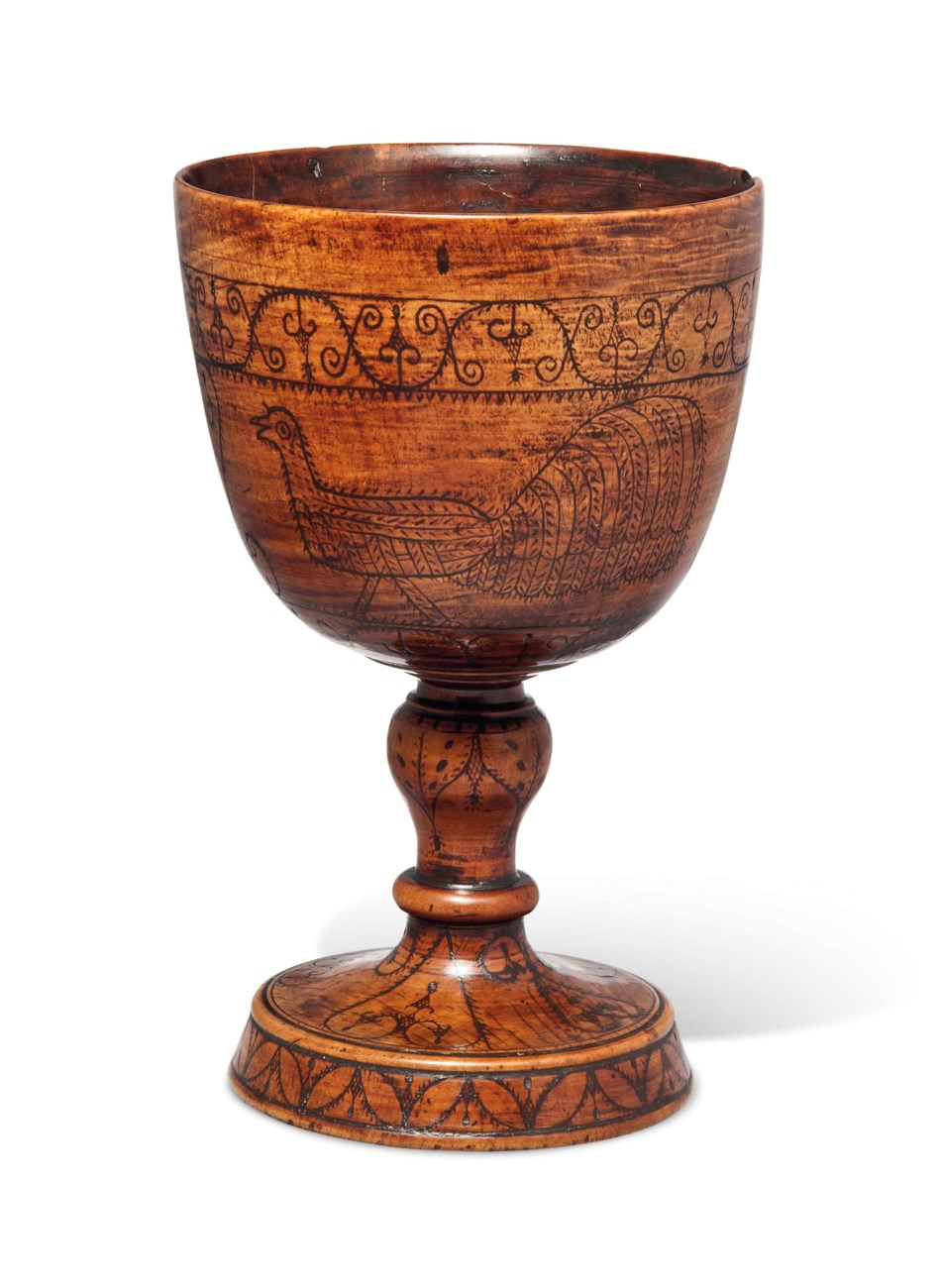 A DECORATED PEARWOOD STANDING CUP, ENGLAND, MID-17TH CENTURY | Christie's