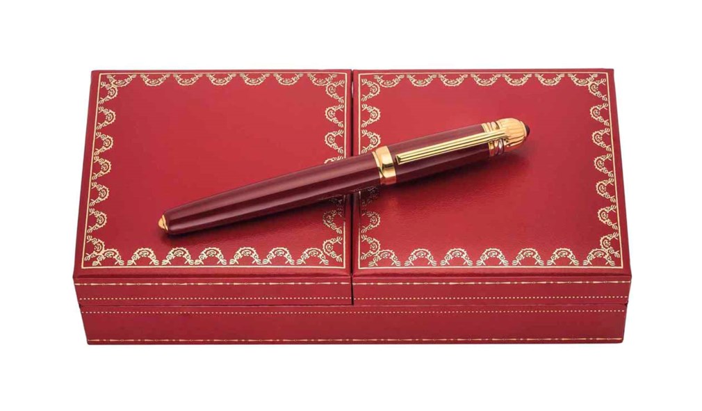 CARTIER. A FINE RED LACQUERED PEN WITH ORIGINAL PRESENTATION BOX ...