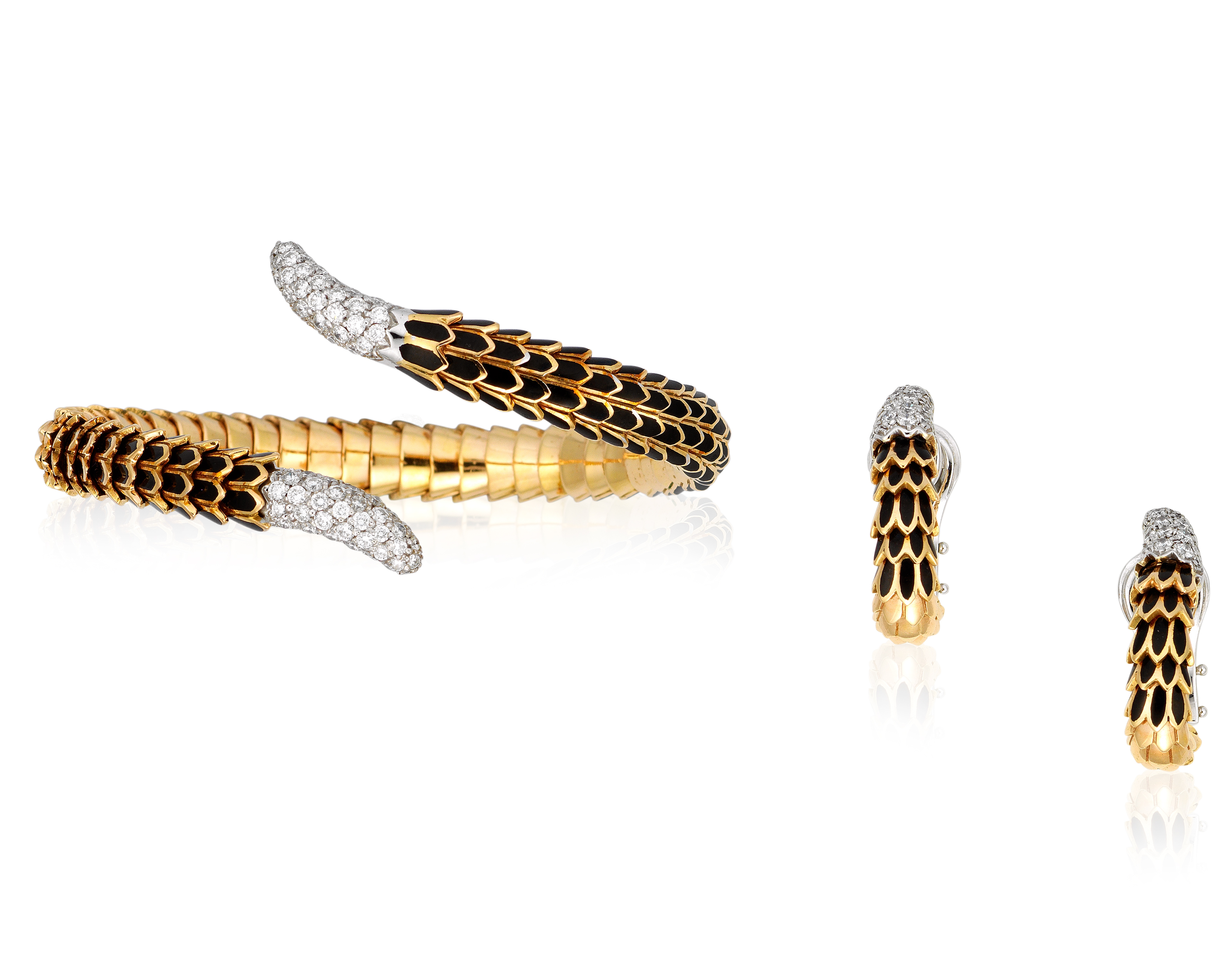 A SET OF ROBERTO COIN DIAMOND AND ENAMEL 'COBRA' BANGLE AND EARRINGS ...