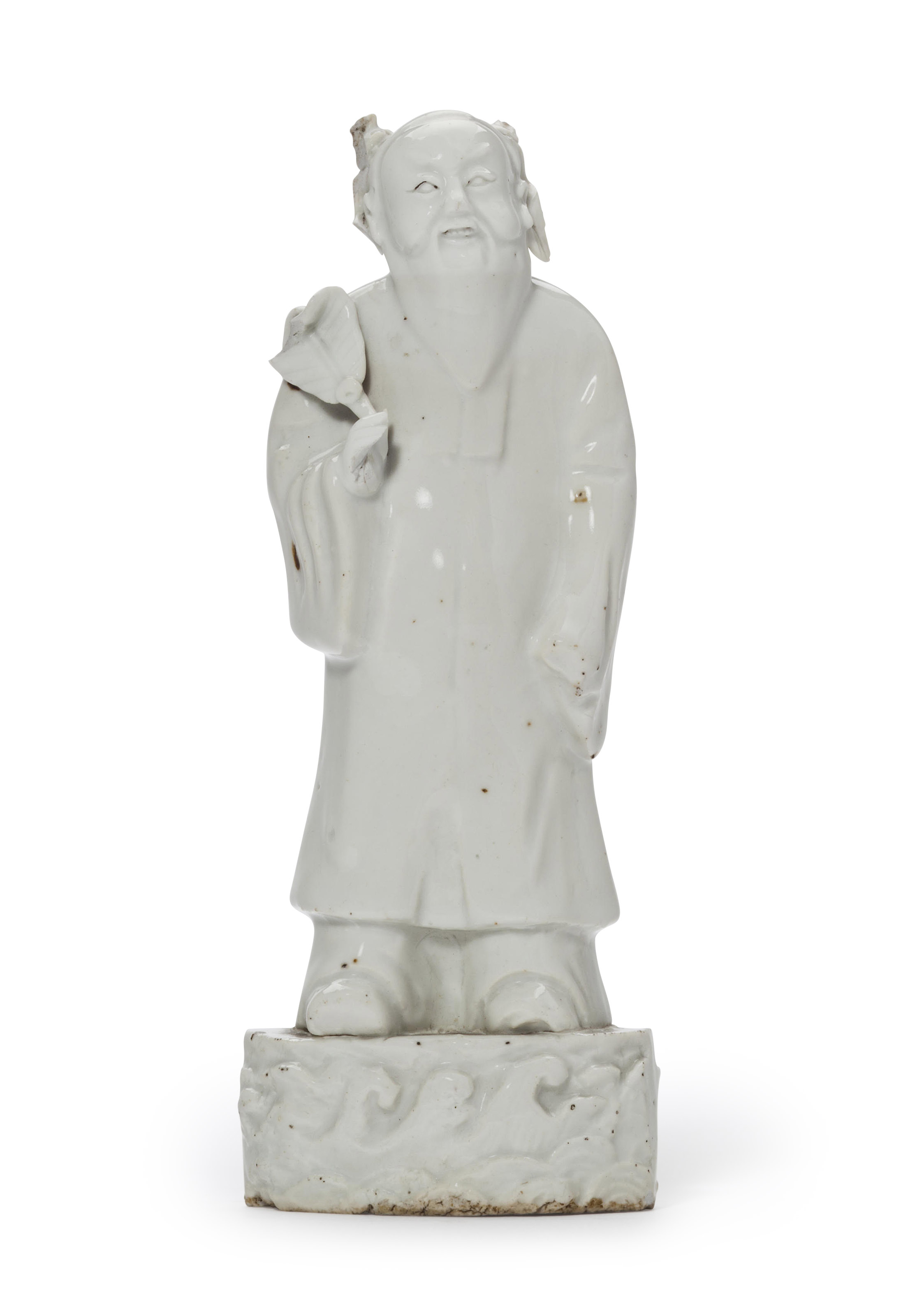 A WHITE-GLAZED FIGURE OF AN IMMORTAL; TOGETHER WITH A FAMILLE ROSE CUP ...