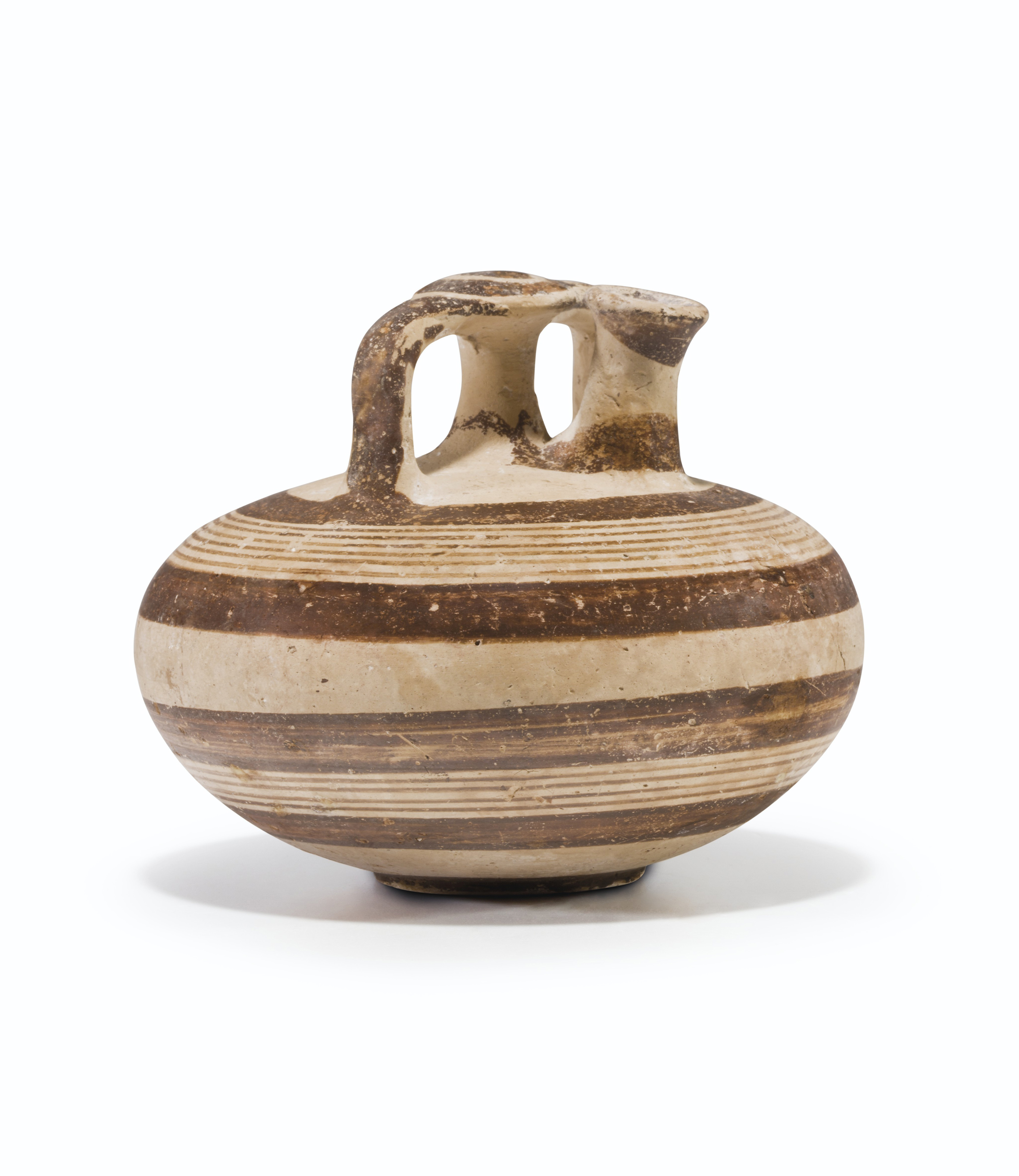 A MYCENAEAN PAINTED POTTERY STIRRUP JAR, CIRCA 1400-1100 B.C. | Christie’s