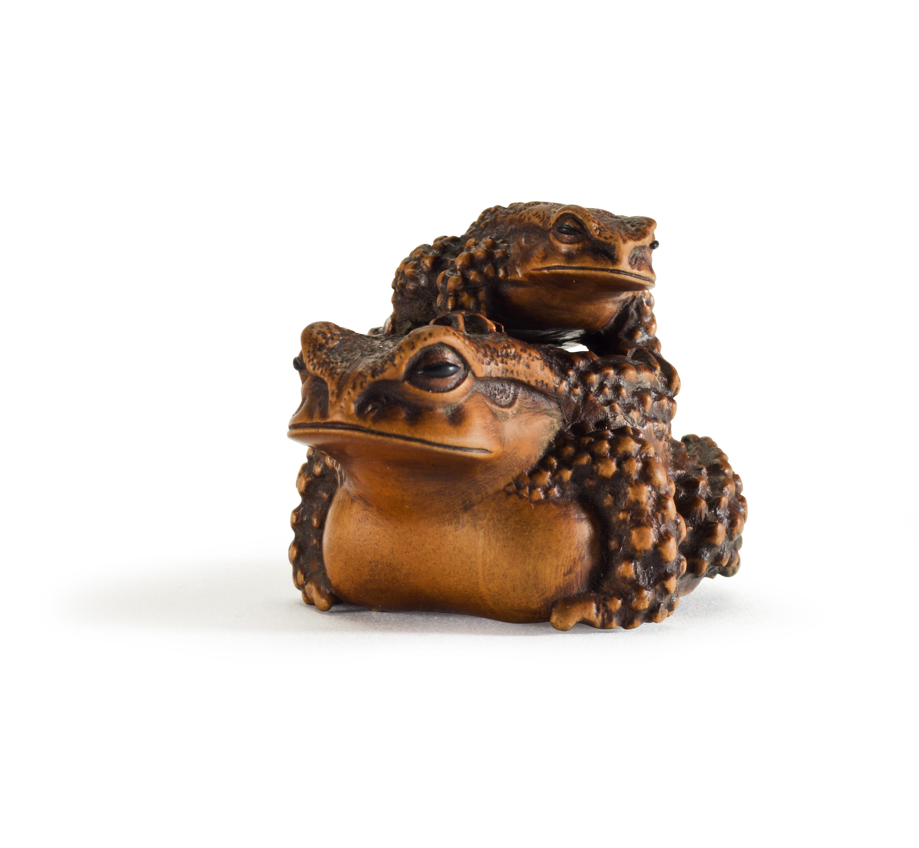 A CARVED WOOD NETSUKE OF TOADS, SIGNED MASANAO, EDO PERIOD (19TH ...