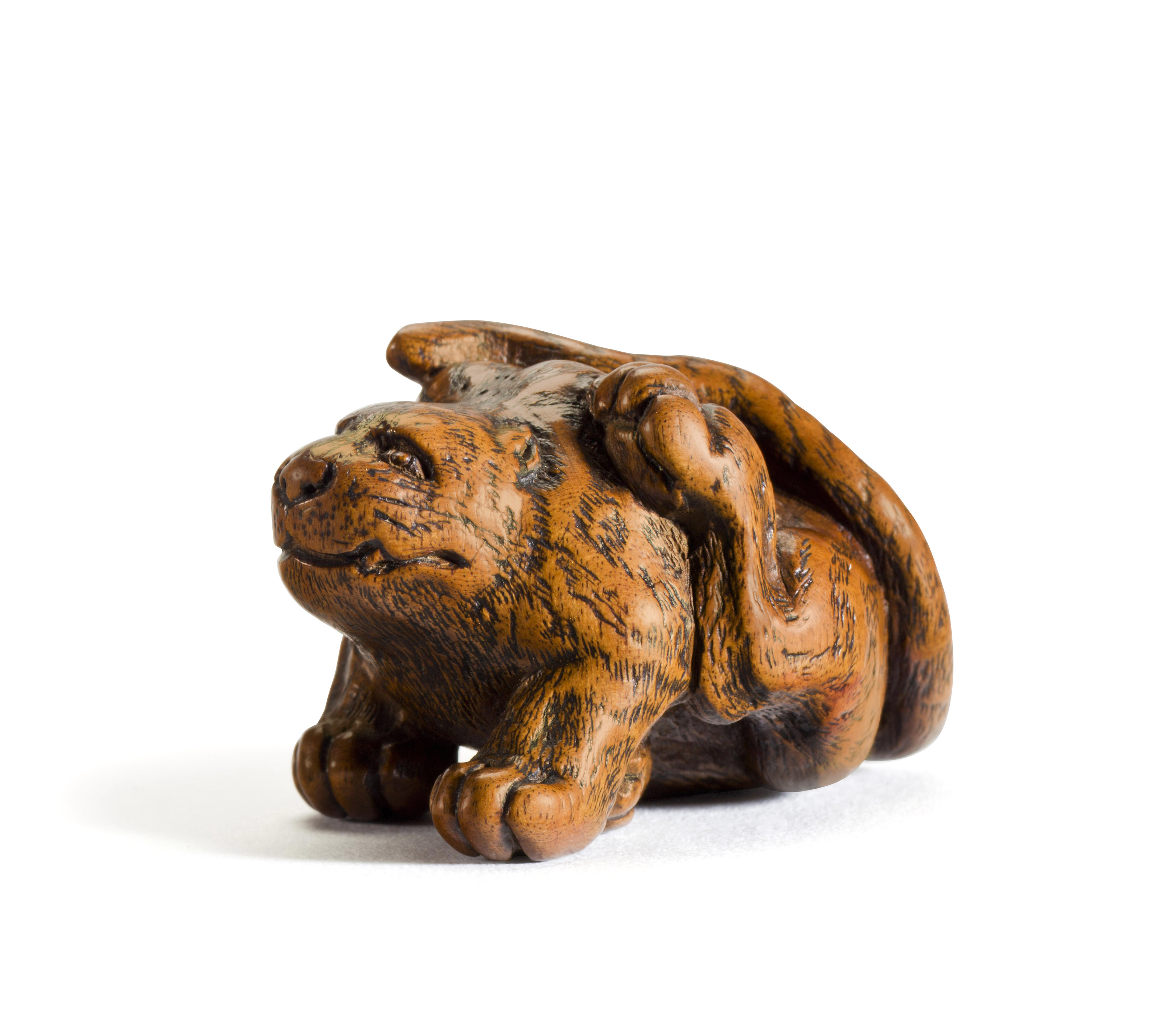 A CARVED WOOD NETSUKE OF A TIGER, SIGNED KOKEI, EDO PERIOD (18TH ...
