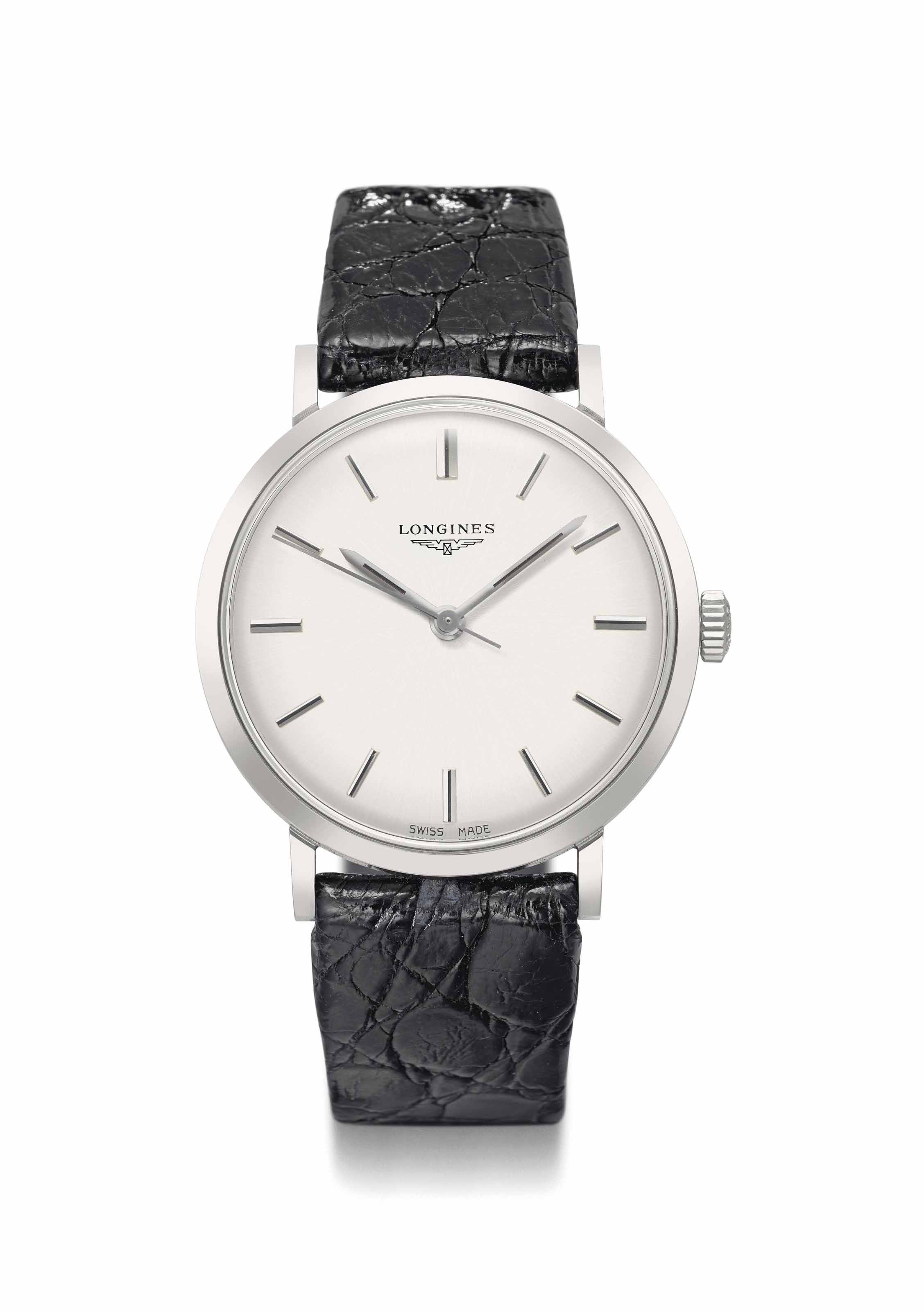 Longines. A stainless steel open face manual wind pocket watch with ...