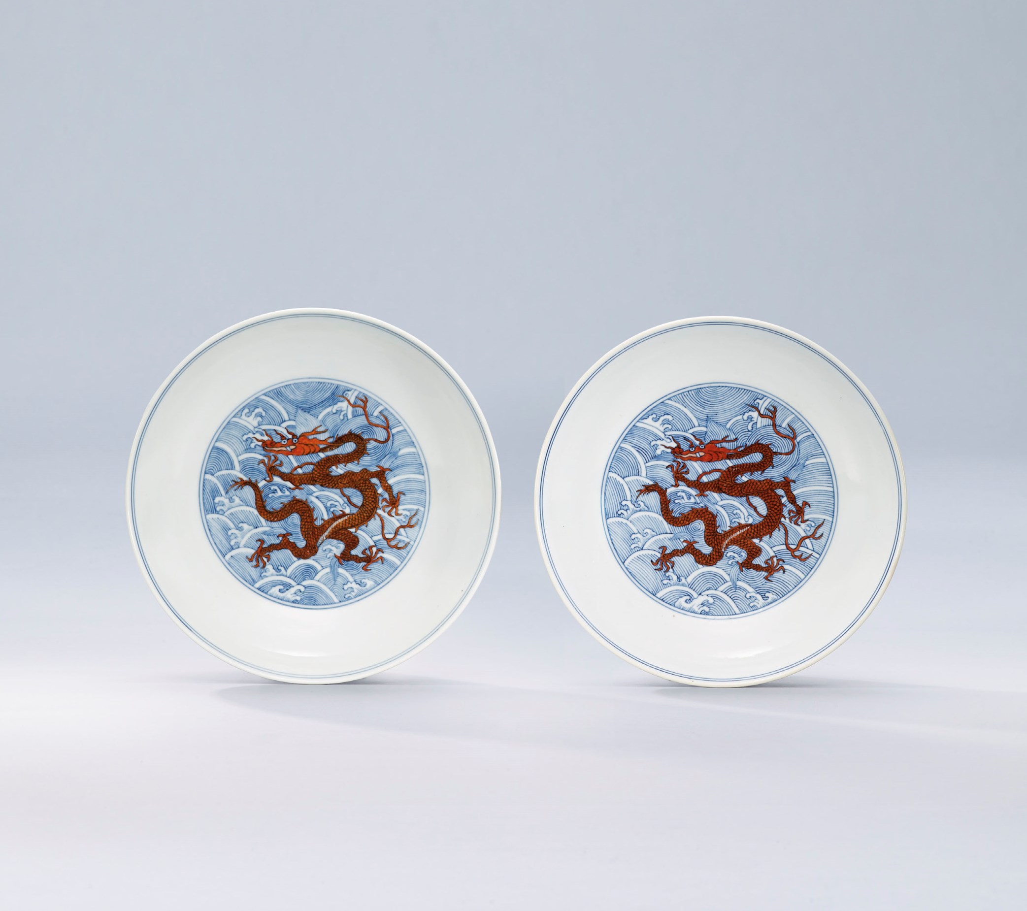 TWO IRON-RED AND UNDERGLAZE-BLUE DECORATED 'DRAGON' DISHES, QIANLONG ...