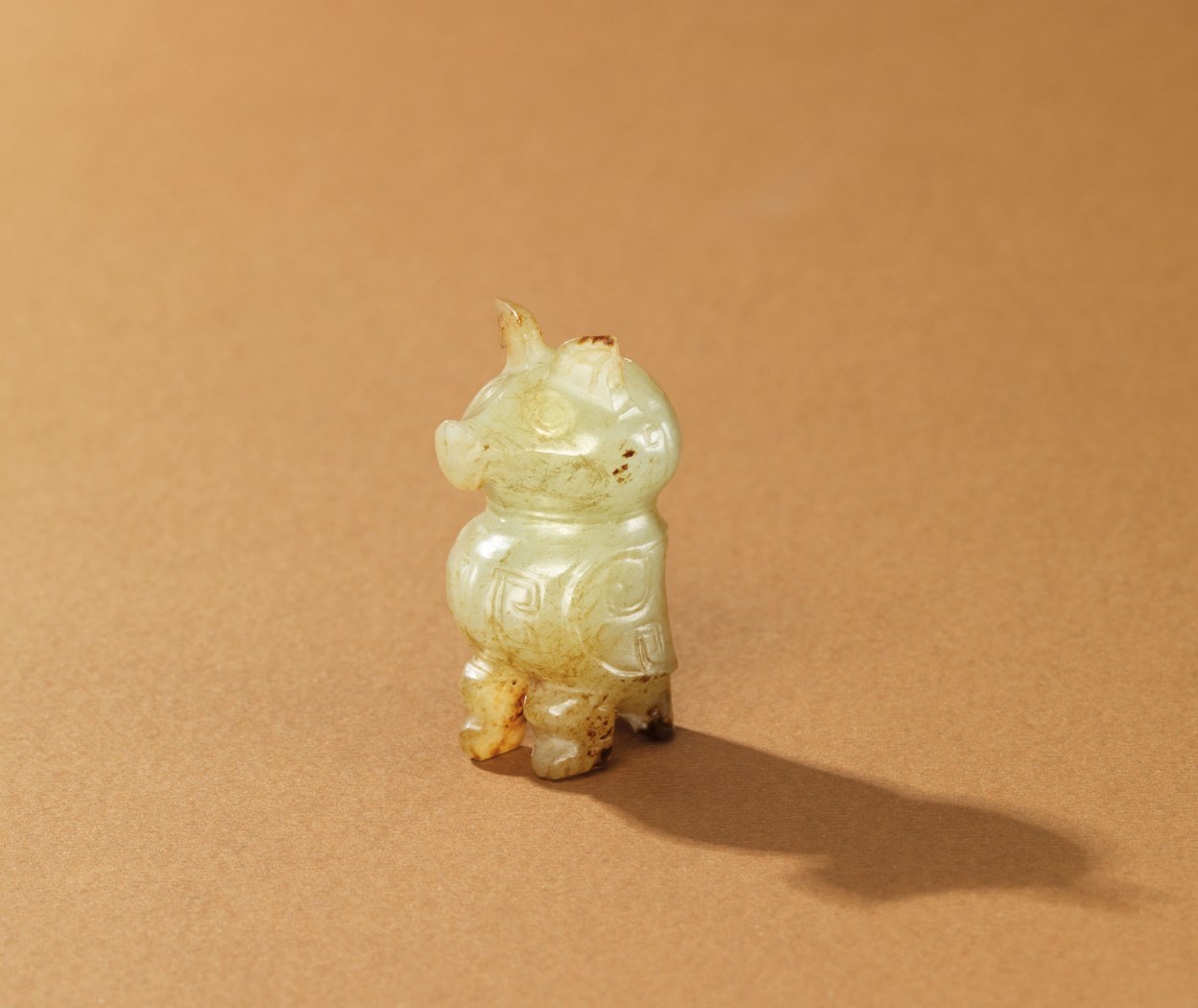 AN IMPORTANT AND RARE CELADON JADE CARVING OF AN OWL, LATE SHANG ...