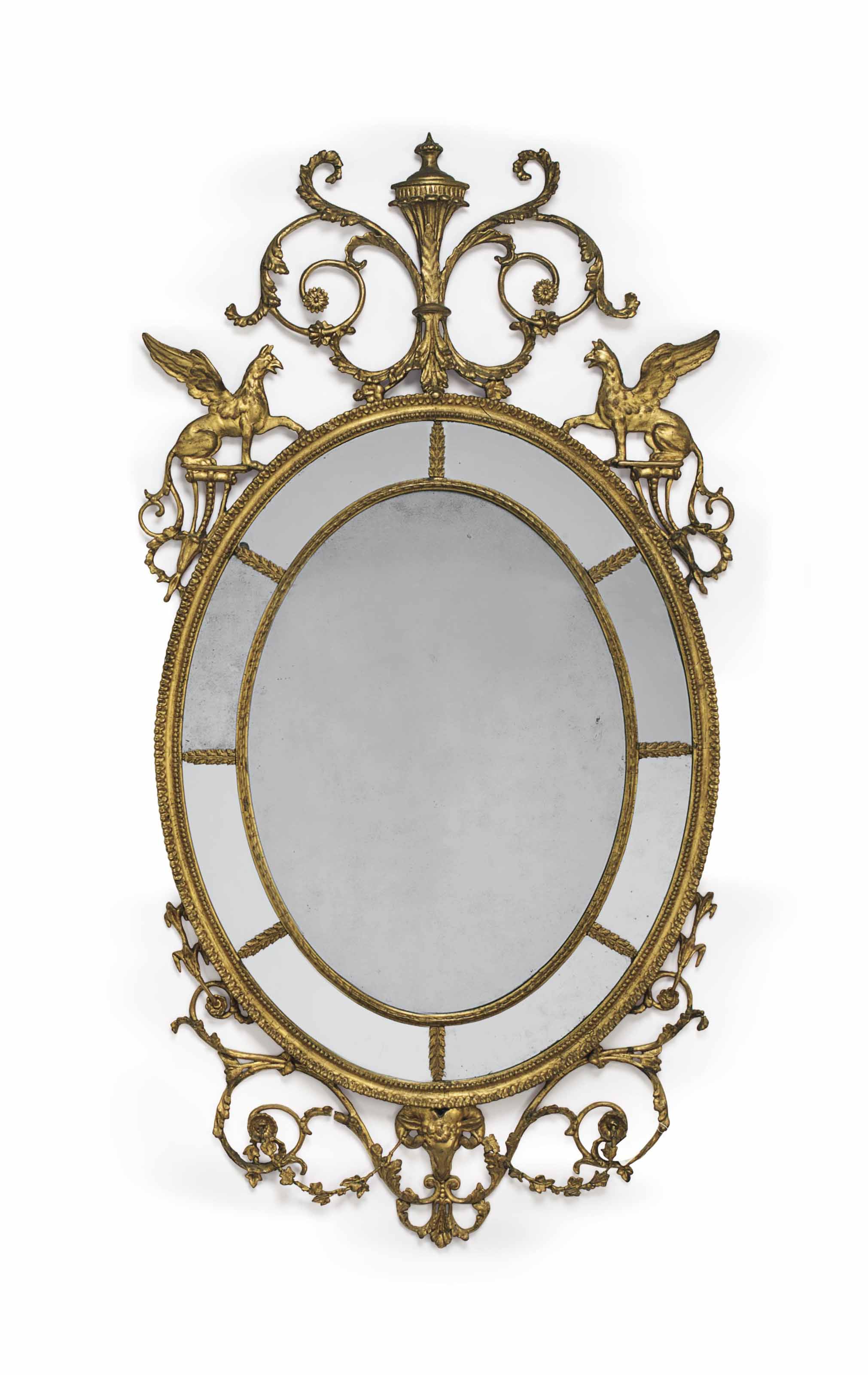 A GEORGE III GILTWOOD CARTON-PIERRE MIRROR