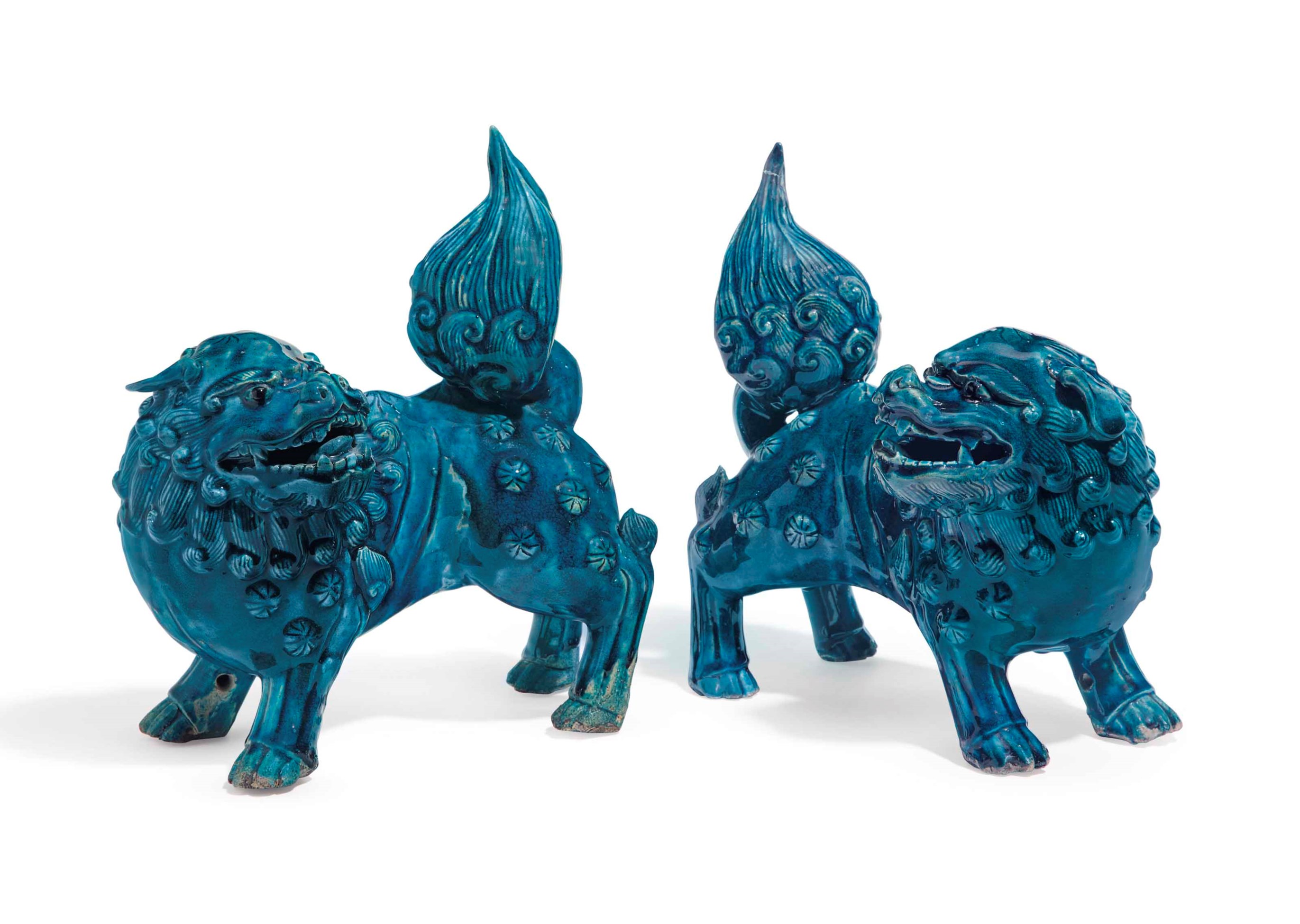 A PAIR OF CHINESE TURQUOISE GLAZED BUDDHIST LIONS