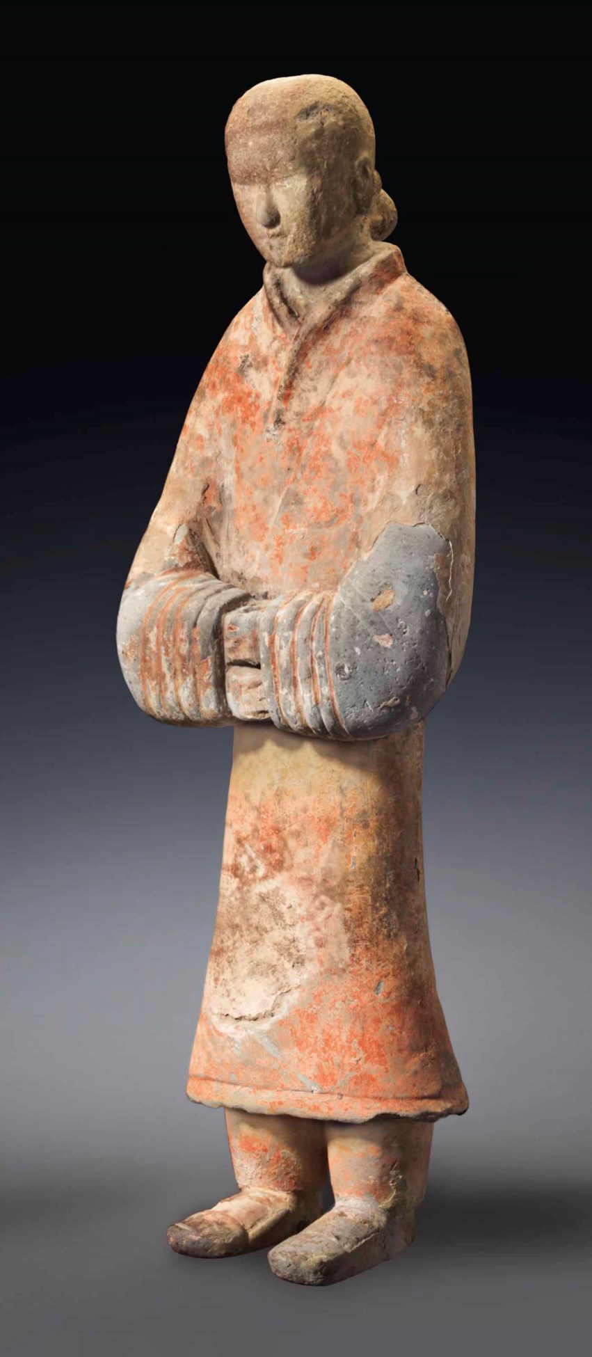 A VERY RARE LARGE PAINTED GREY POTTERY FIGURE OF A FEMALE ATTENDANT