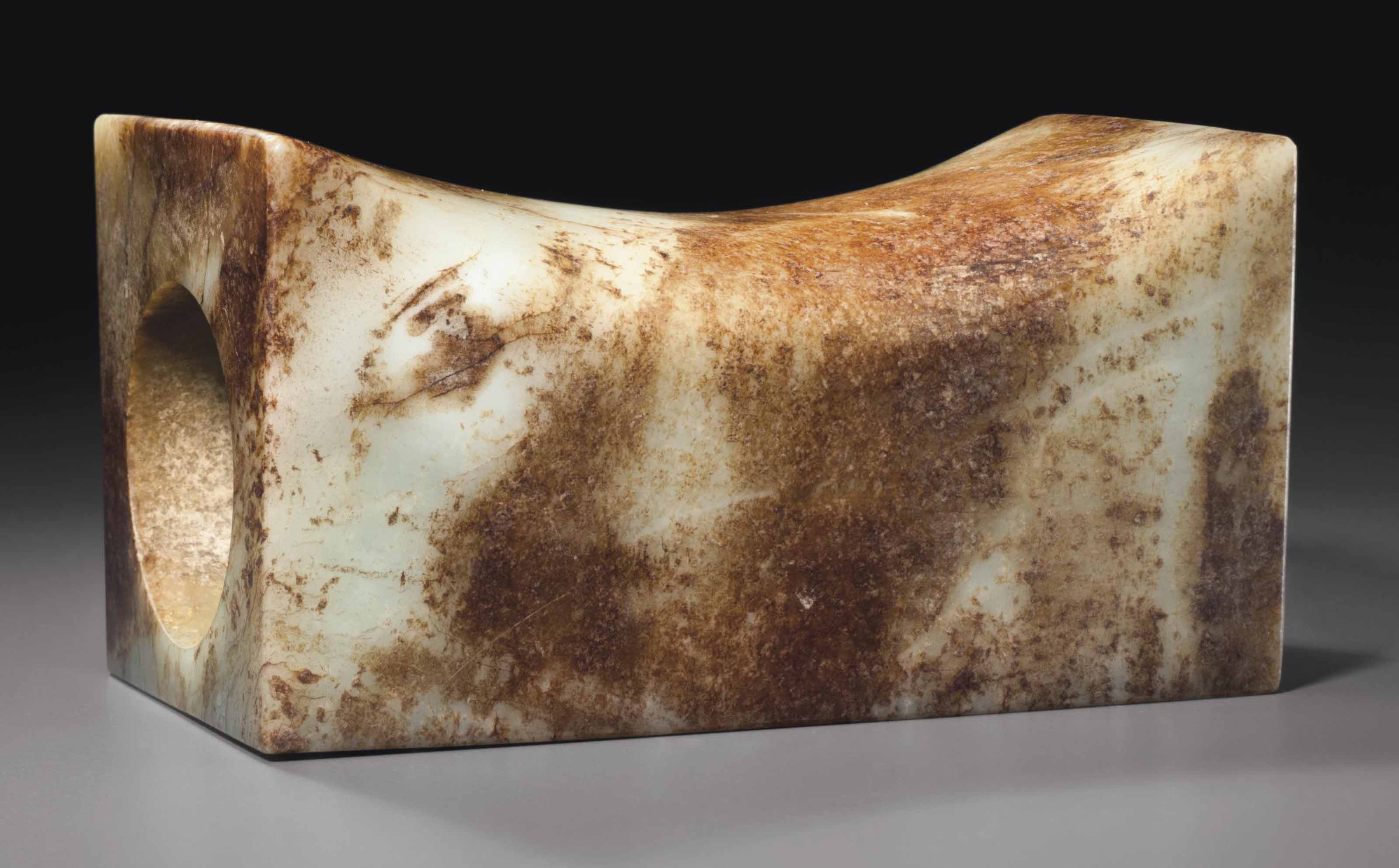A WHITE AND RUSSET-STAINED WHITE JADE PILLOW , POSSIBLY MING DYNASTY OR ...