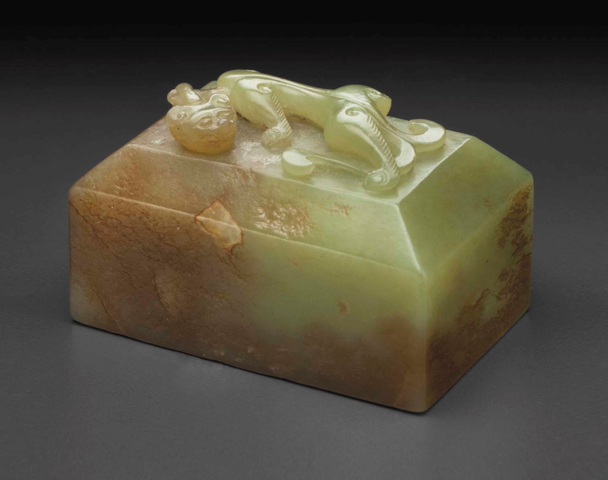 A YELLOW AND RUSSET JADE RECTANGULAR WEIGHT OR SEAL, CHINA, MING-EARLY ...
