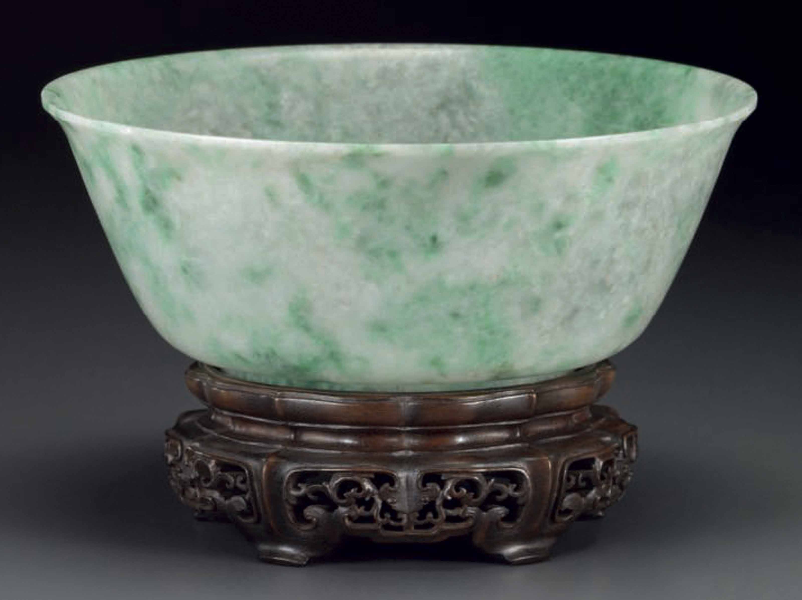 A LARGE MOTTLED 'APPLE GREEN' JADEITE BOWL