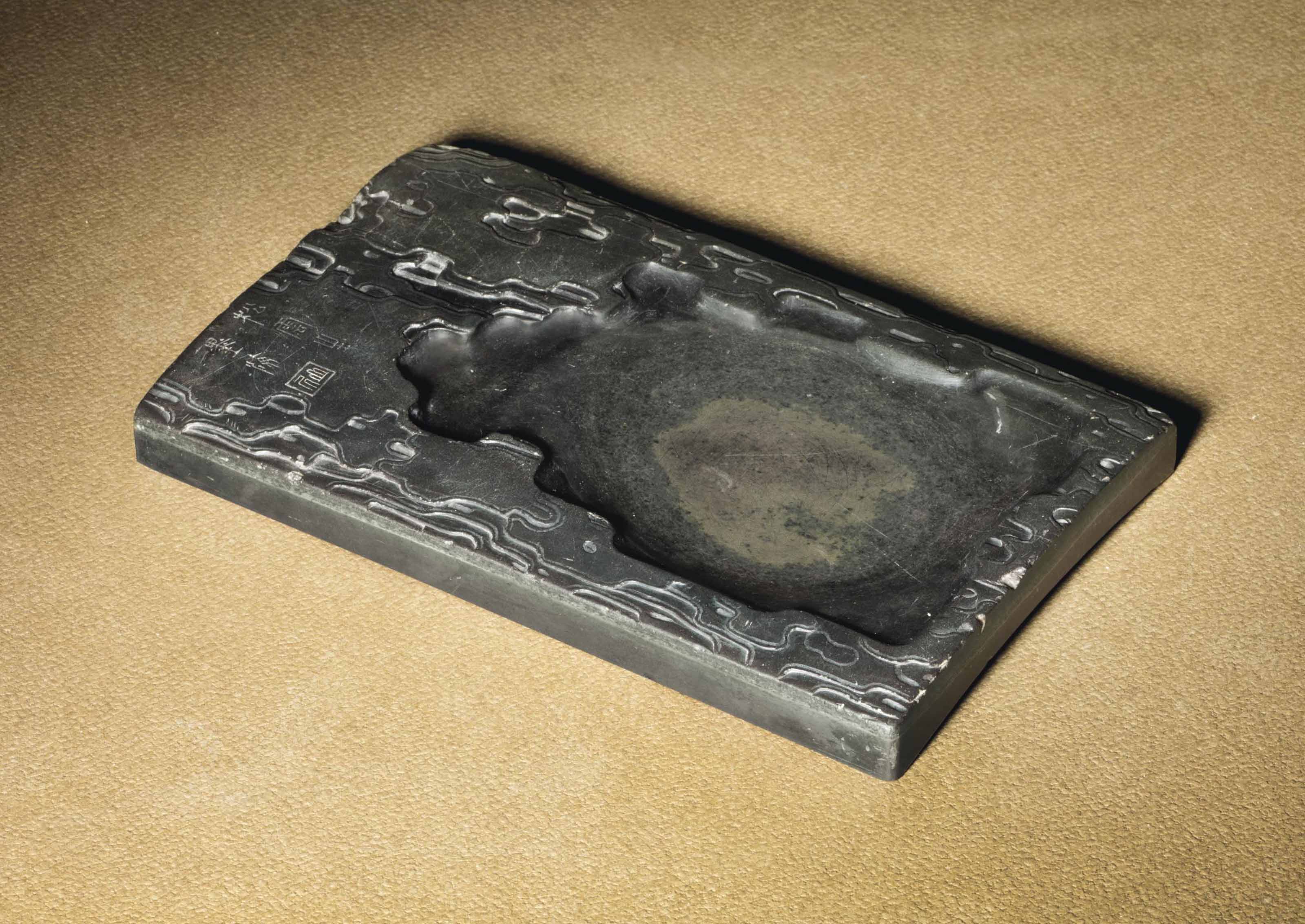 A CARVED DUAN INK STONE